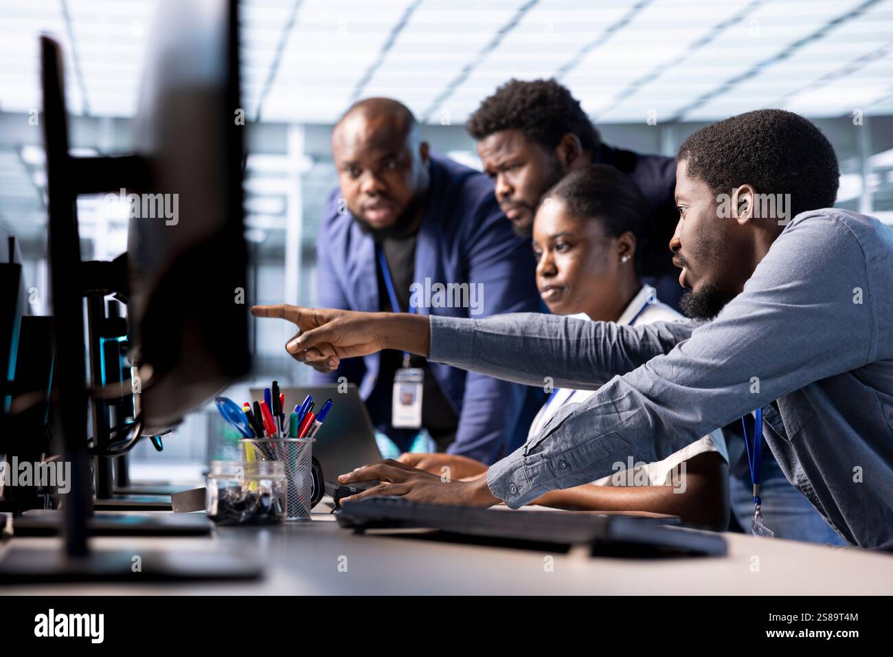 Data center coworkers doing brainstorming, creating technical documentation for software ...