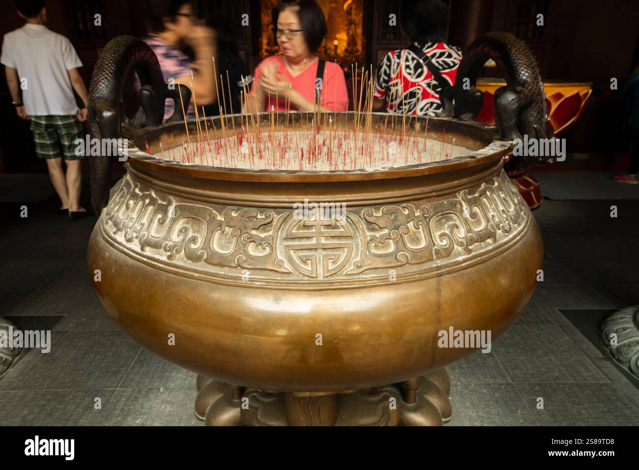 Singapore - Oct 23, 2019: A huge cauldron filled with incense offerings ...