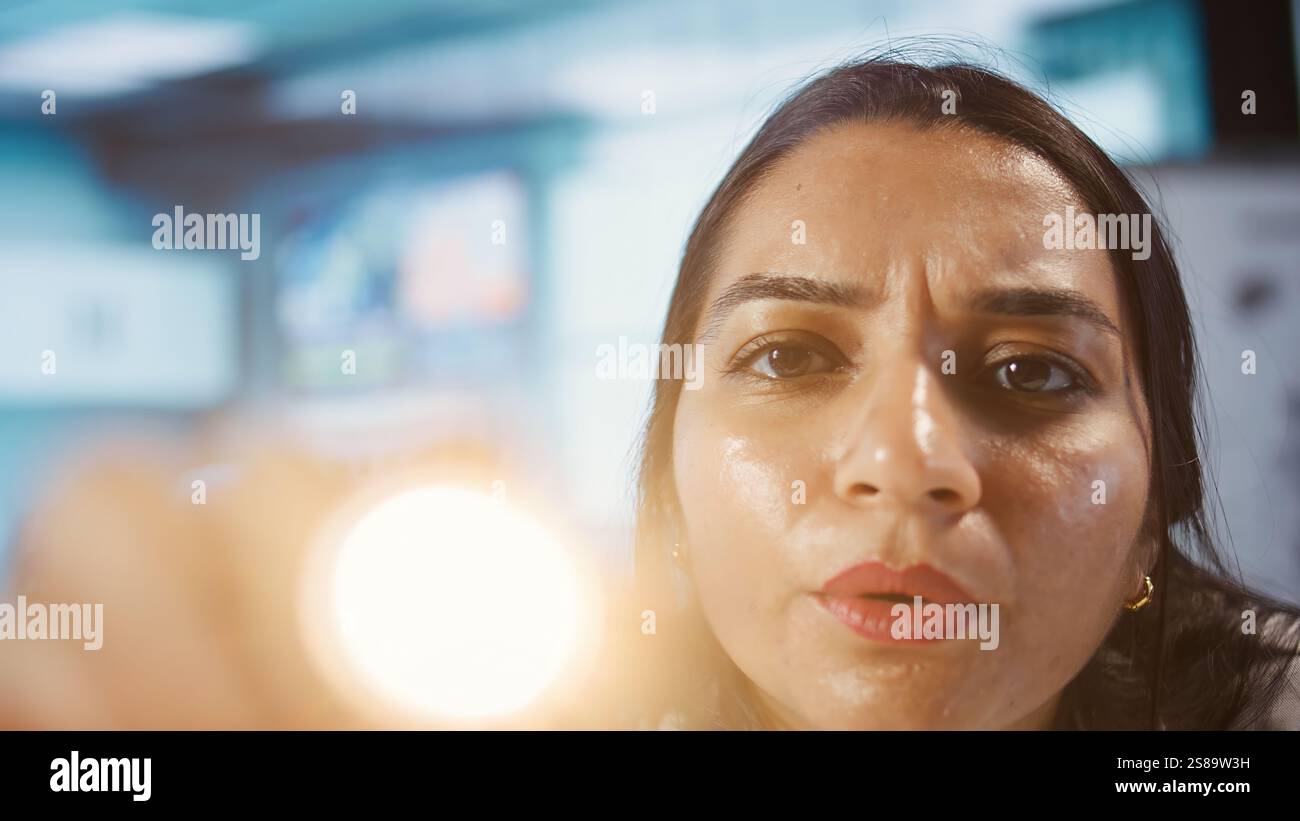 Optometrist examining eyesight with diagnostic tools for a male patient ...