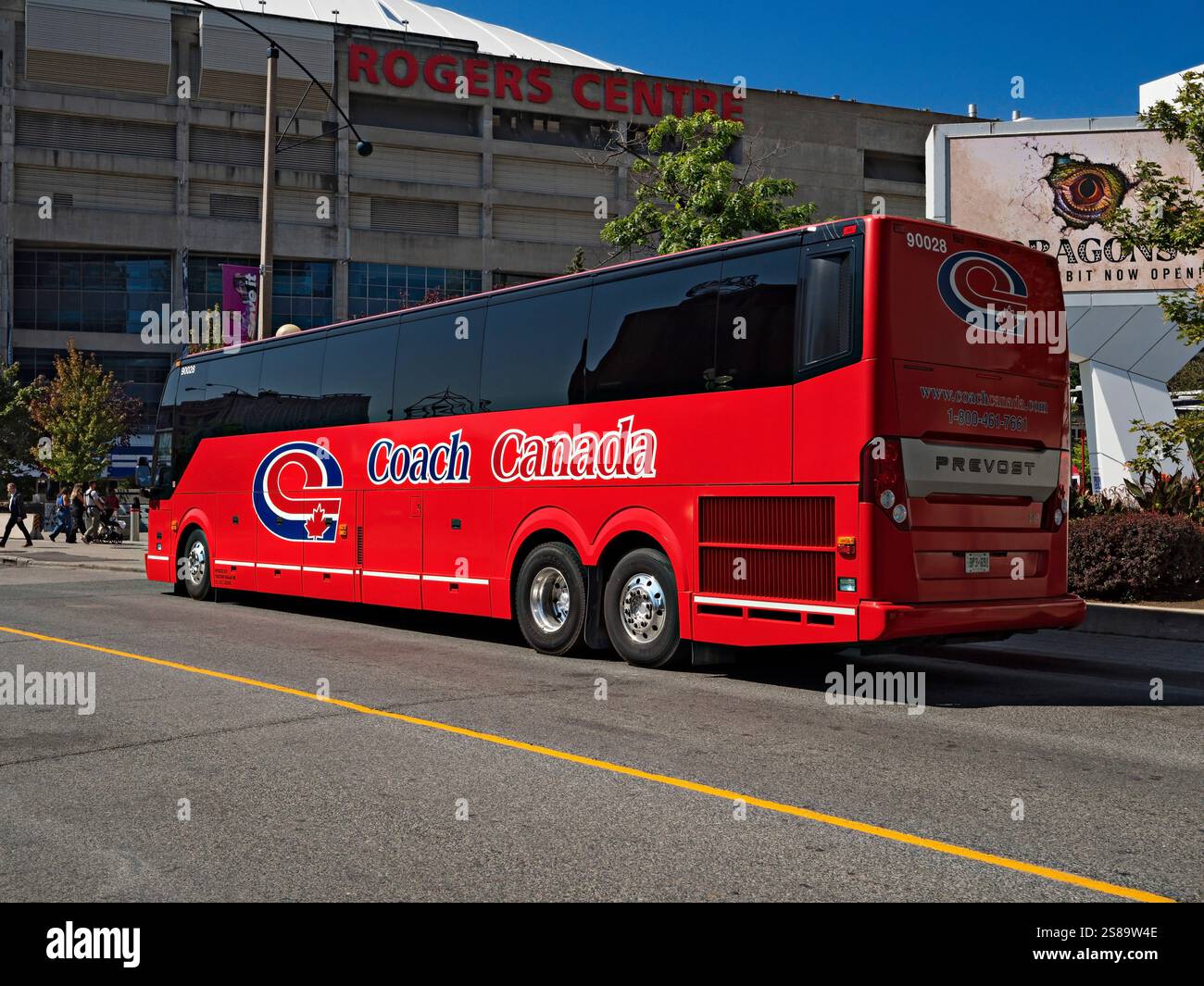 Toronto Canada / A Coach Canada Bus transports tourists to the CN Tower and Ripley's Aquarium ...