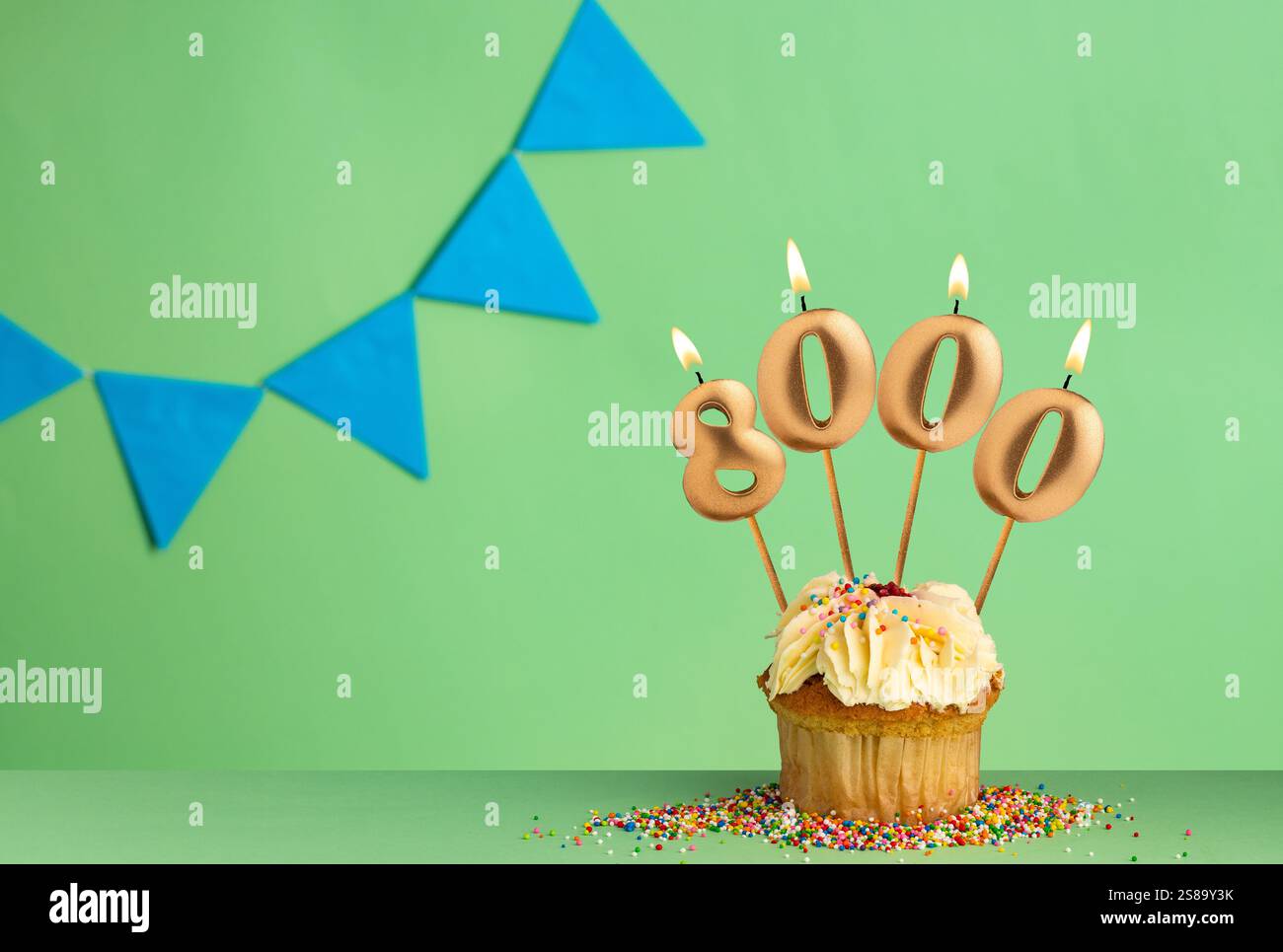 Candles forming the number 8000 - Green background Stock Photo - Alamy
