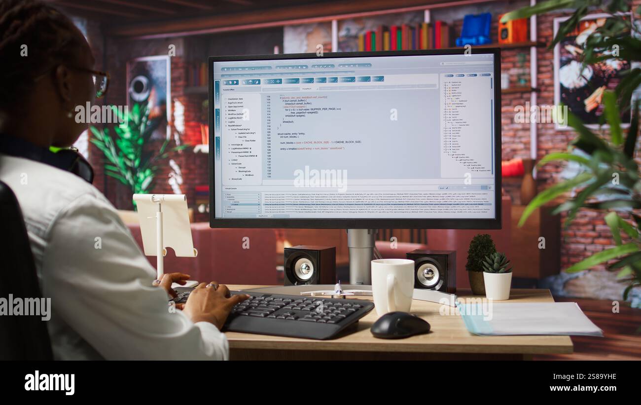 Woman in home office looking at UI on PC screen, typing and executing ... Woman in home office looking at UI on PC screen, typing and executing ...