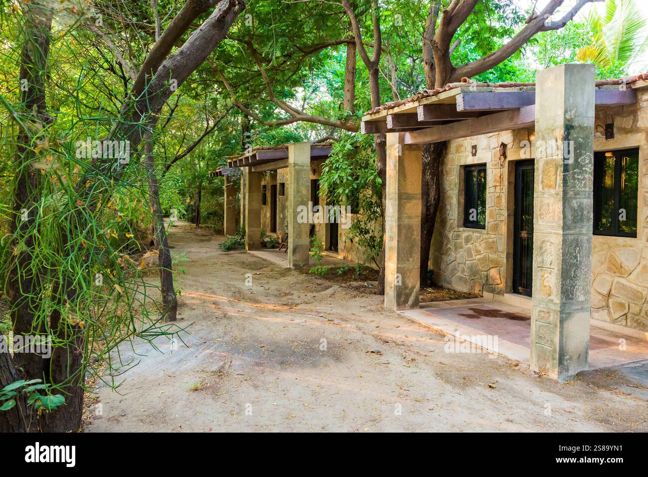South India. Traditional Indian houses near lake Stock Photo - Alamy