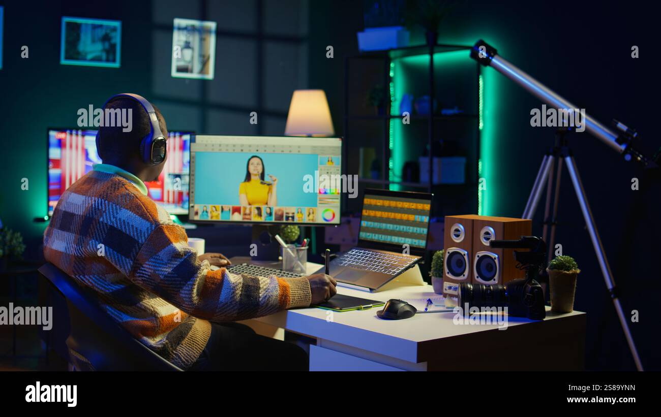 Remote graphic designer using advanced editing software to retouch ...