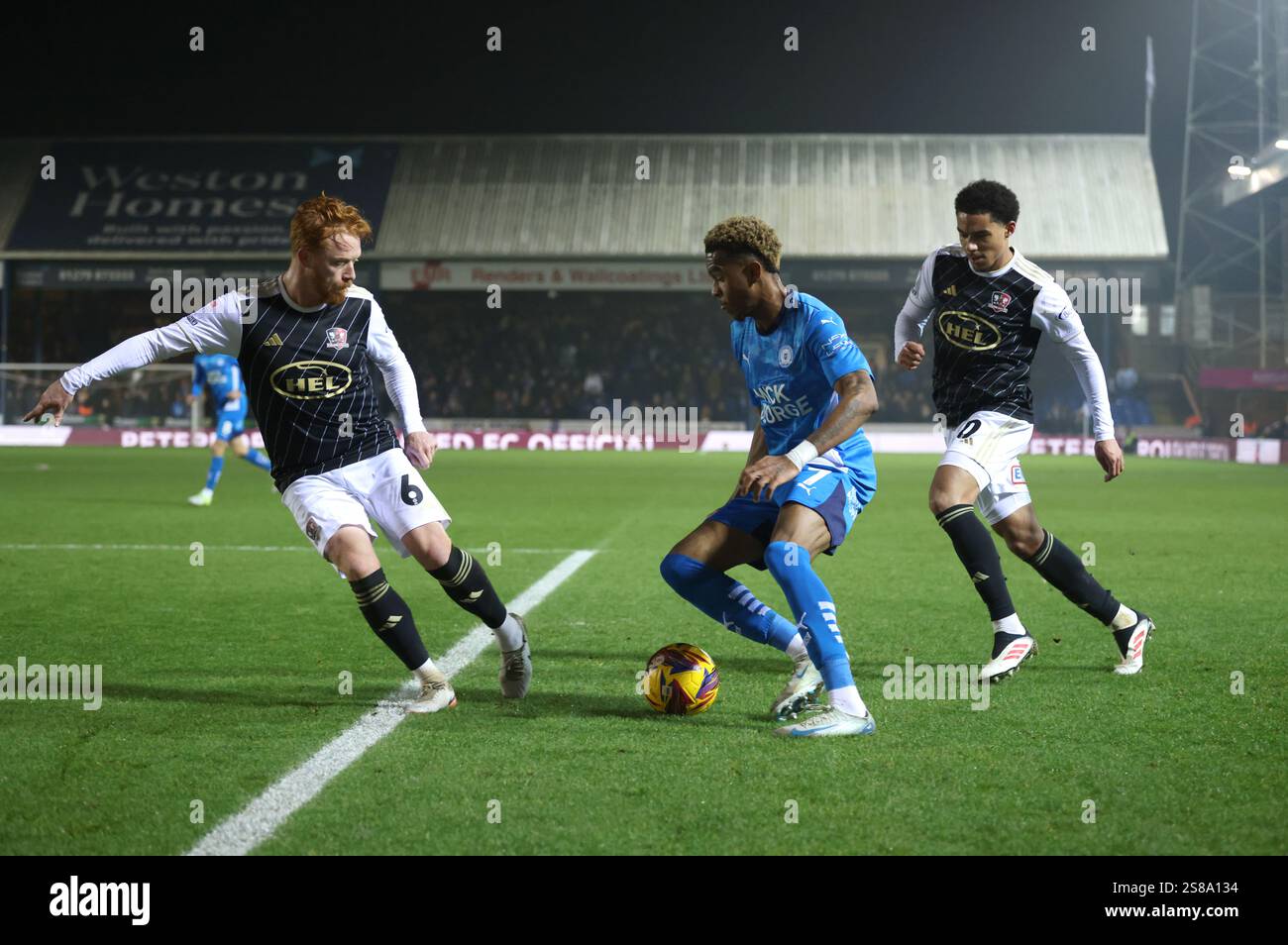 Peterborough, UK. 21st Jan, 2025. Ryan Woods (EC) Malik Mothersille (PU ...