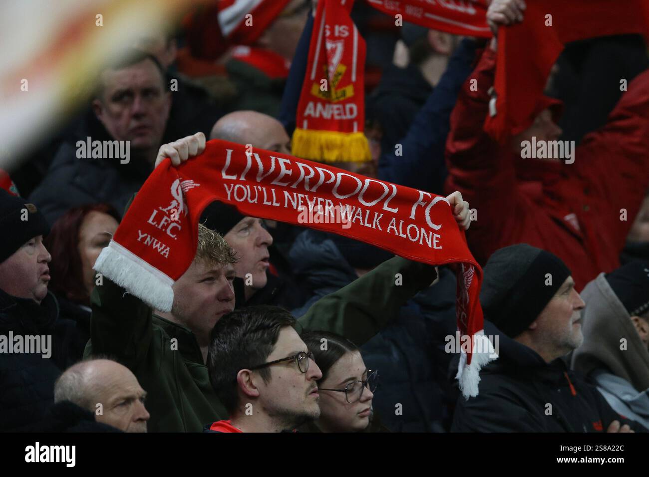 Liverpool, UK. 21st Jan, 2025. Liverpool fans in the Kop singing You'll ...
