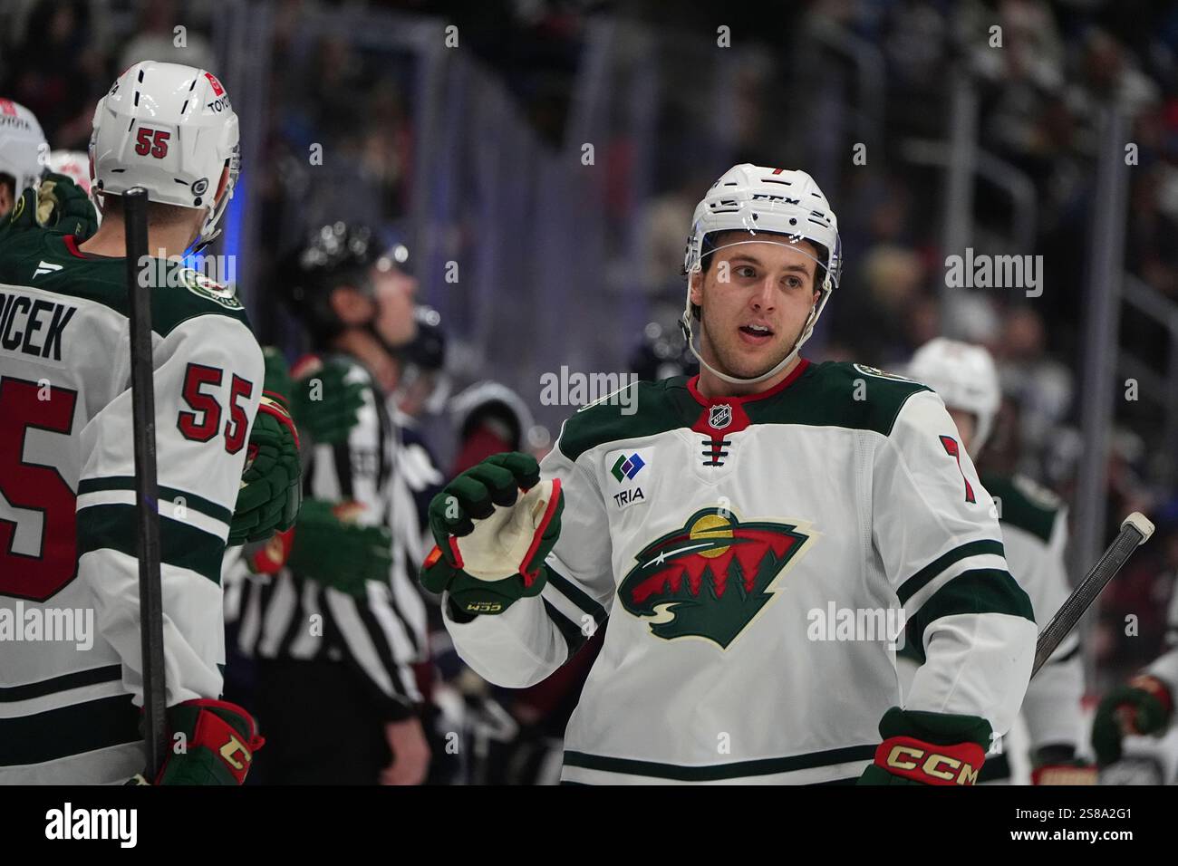 Minnesota Wild defenseman Brock Faber (7) is congratulated as he passes ...