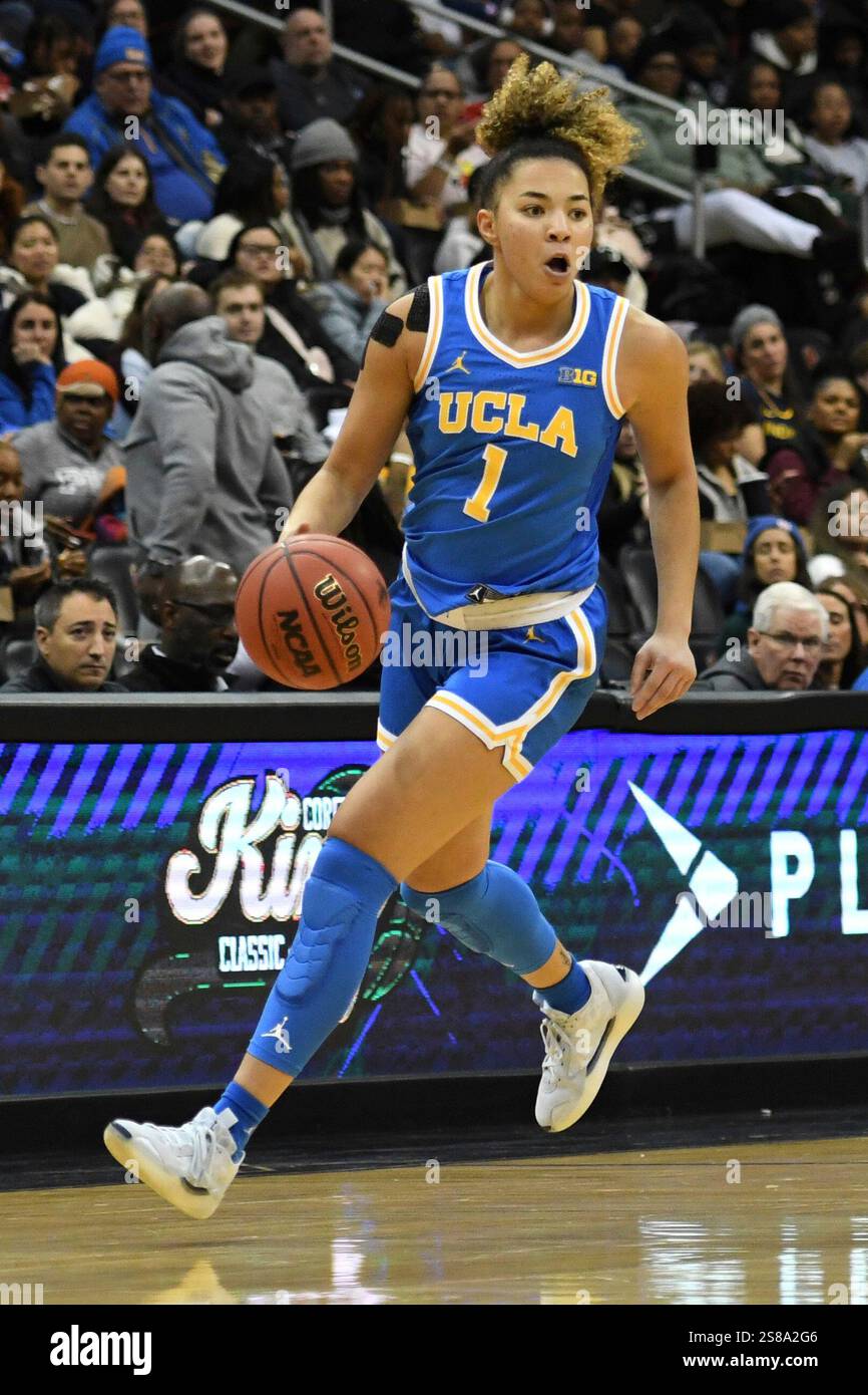 UCLA guard Kiki Rice dribbles the ball during the first half of an NCAA ...