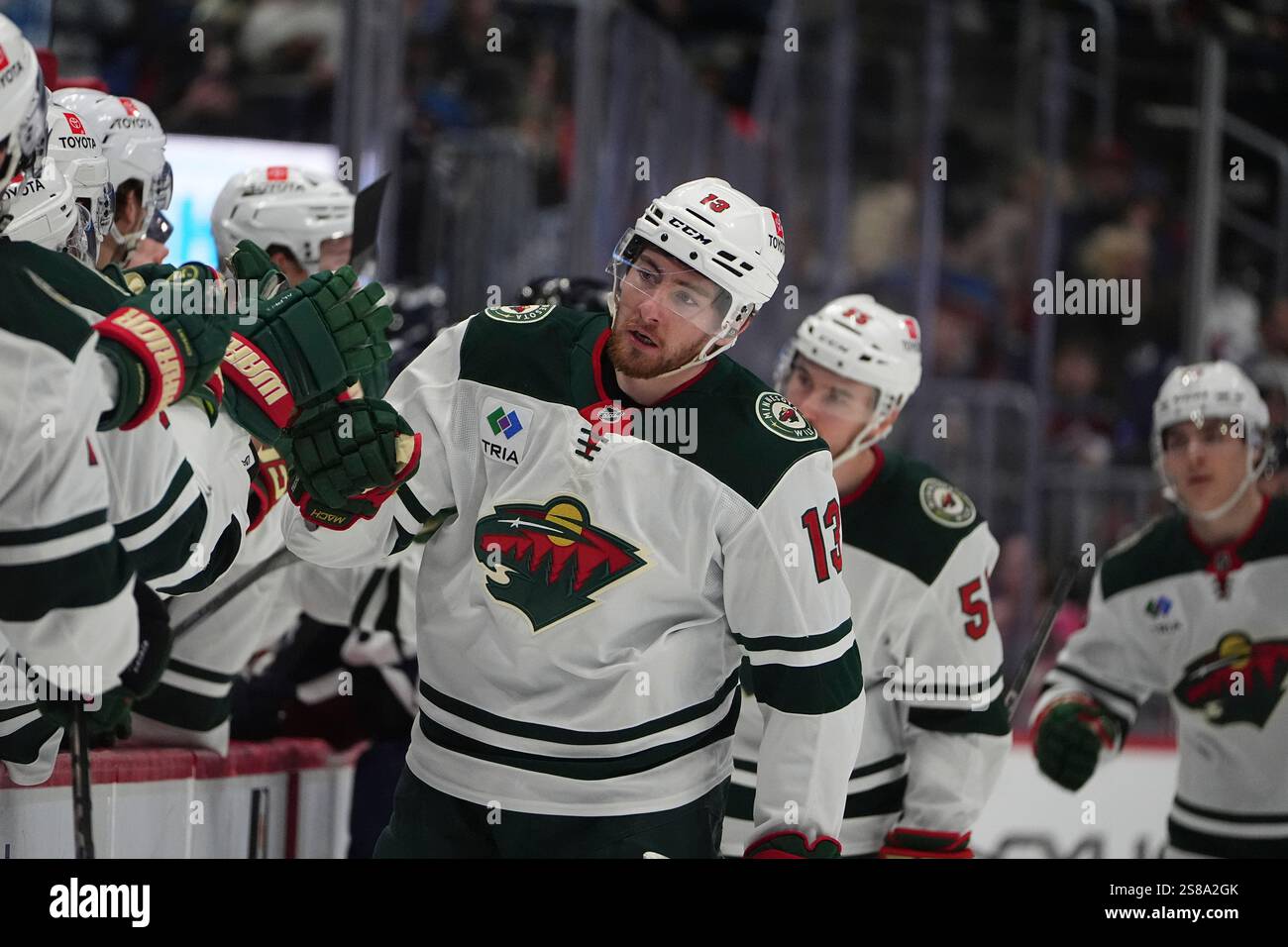 Minnesota Wild center Yakov Trenin (13) is congratulated as he passes ...