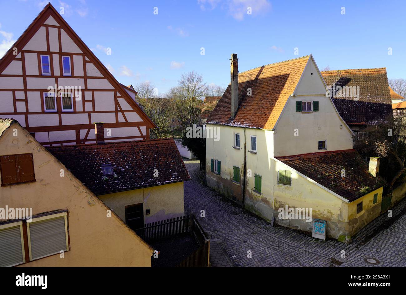 Old houses with steep sloping roofs in a medieval town in southern ...