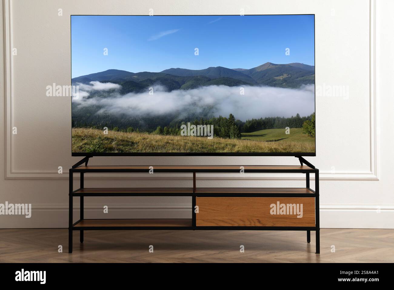 TV set with nature landscape on screen in room Stock Photo - Alamy