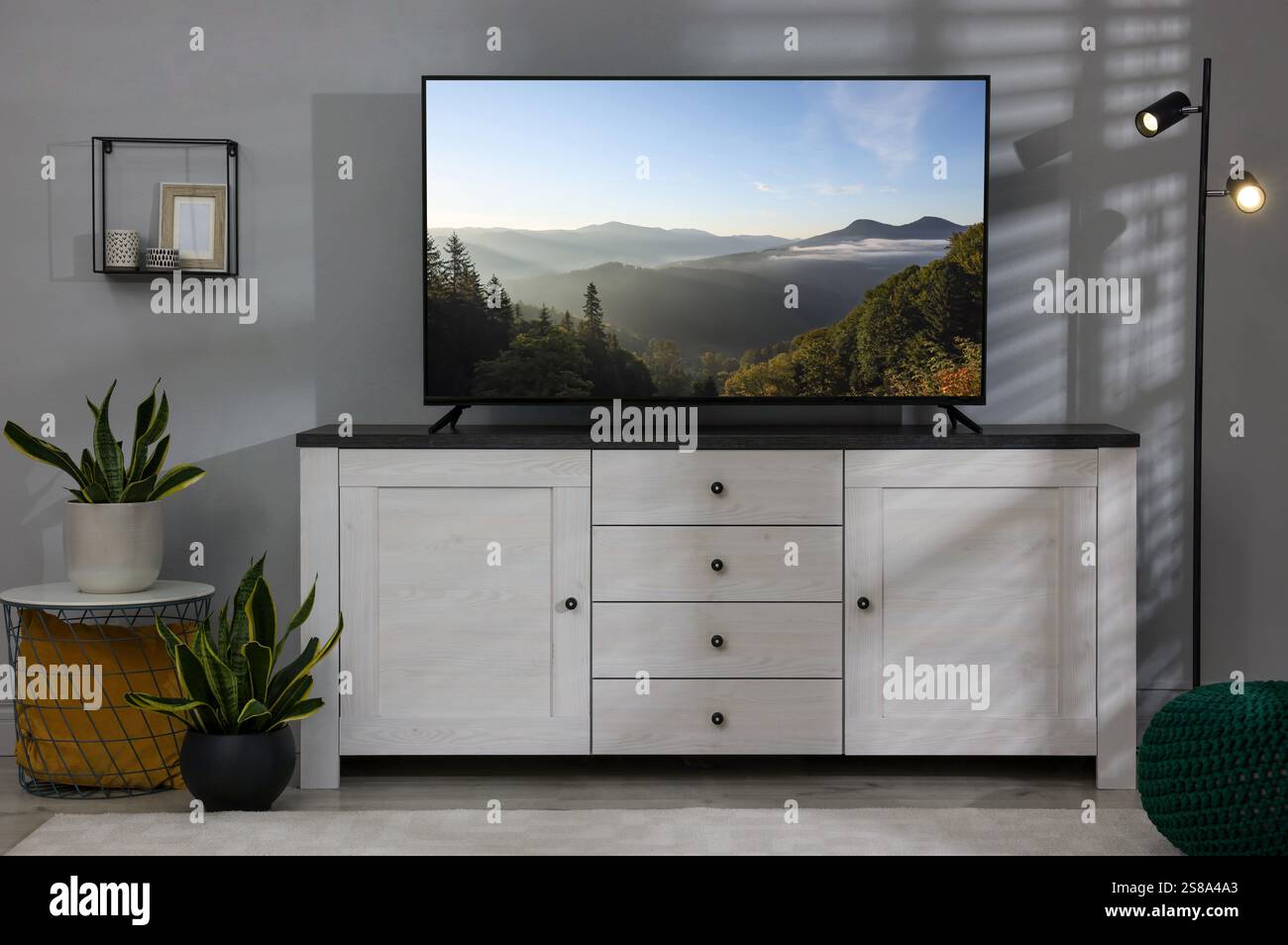 TV set with nature landscape on screen in room Stock Photo - Alamy