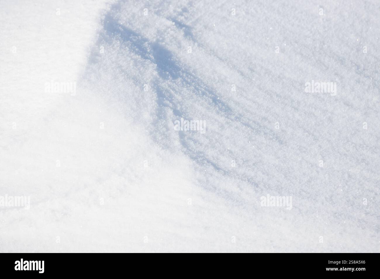 lines of light and shadow on grainy white snow surface Stock Photo - Alamy