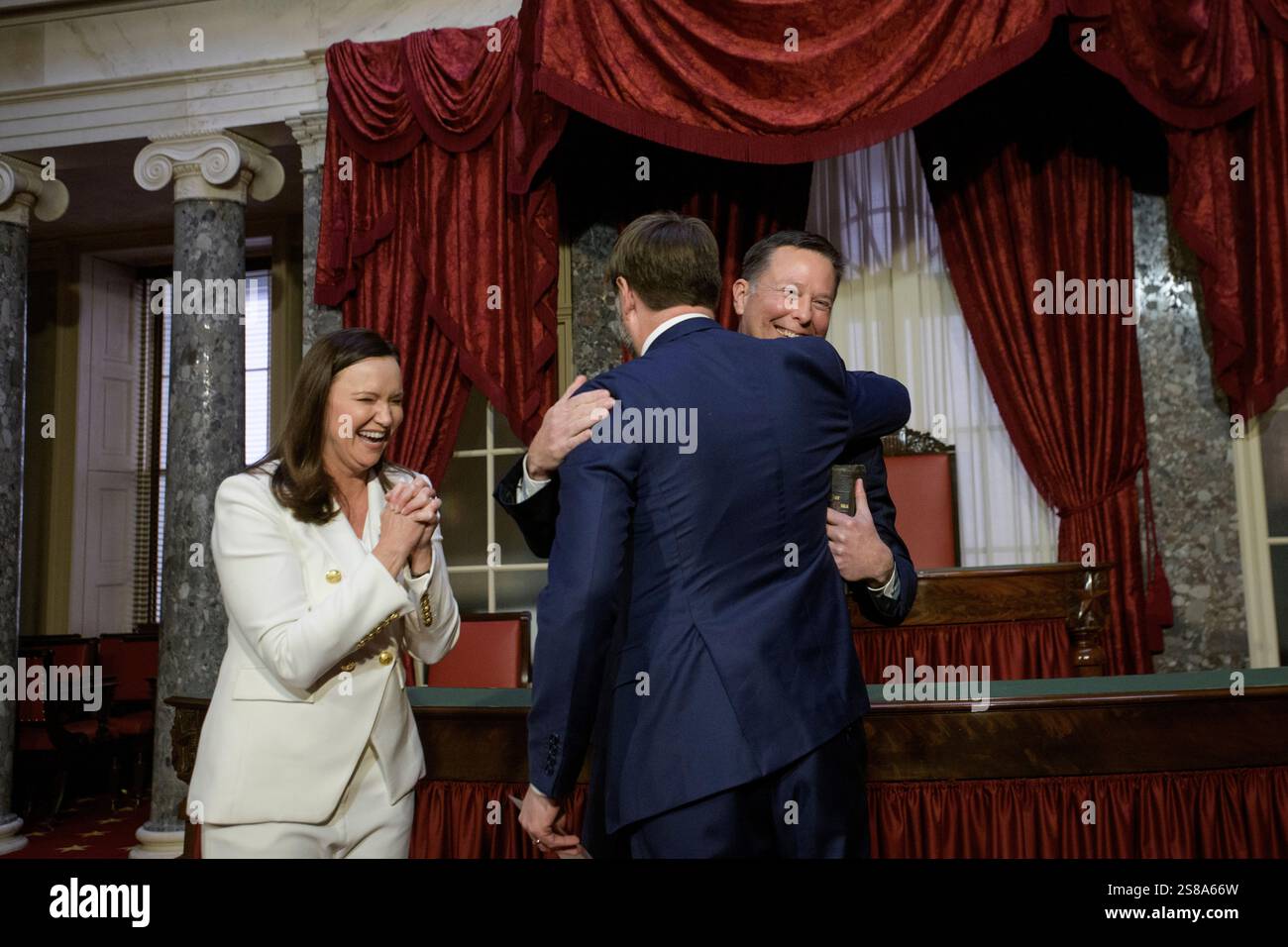 Vice President JD Vance, center, gets a hug from Justin Duralia ...