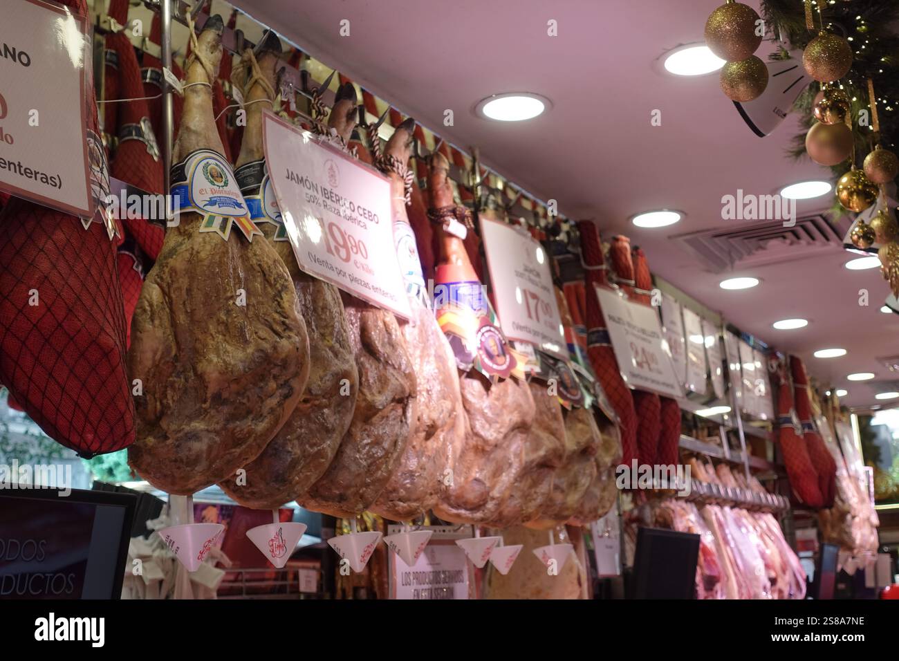 Jamon (cured ham) hanging inside a shop that sells them in Madrid Stock ...