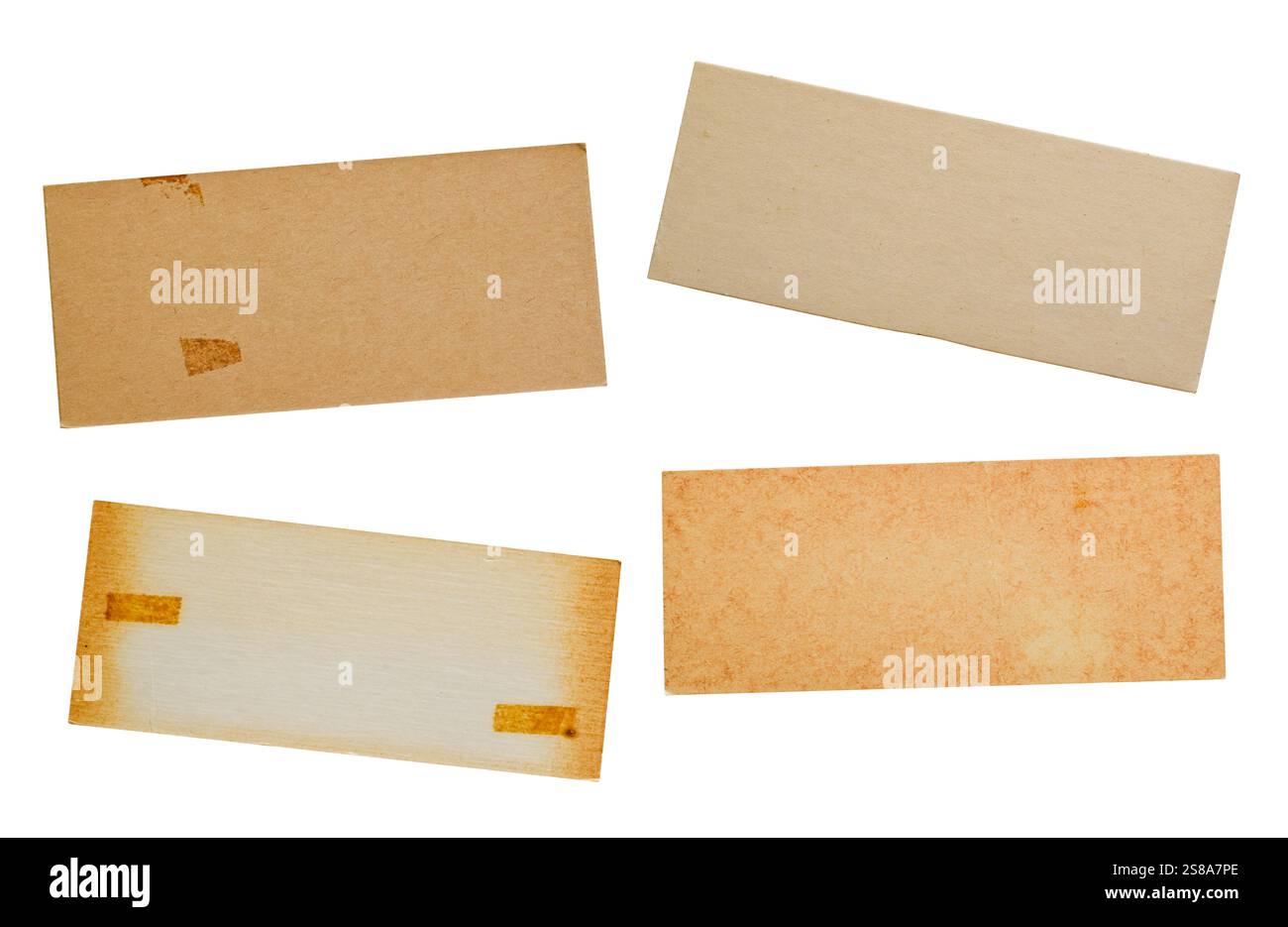 Set of four old rectangular cardboard paper with aged yellow stains ...