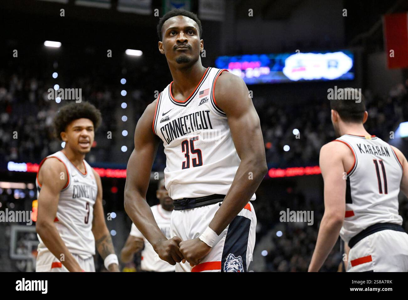 UConn center Samson Johnson (35) flexes after making a basket in the ...