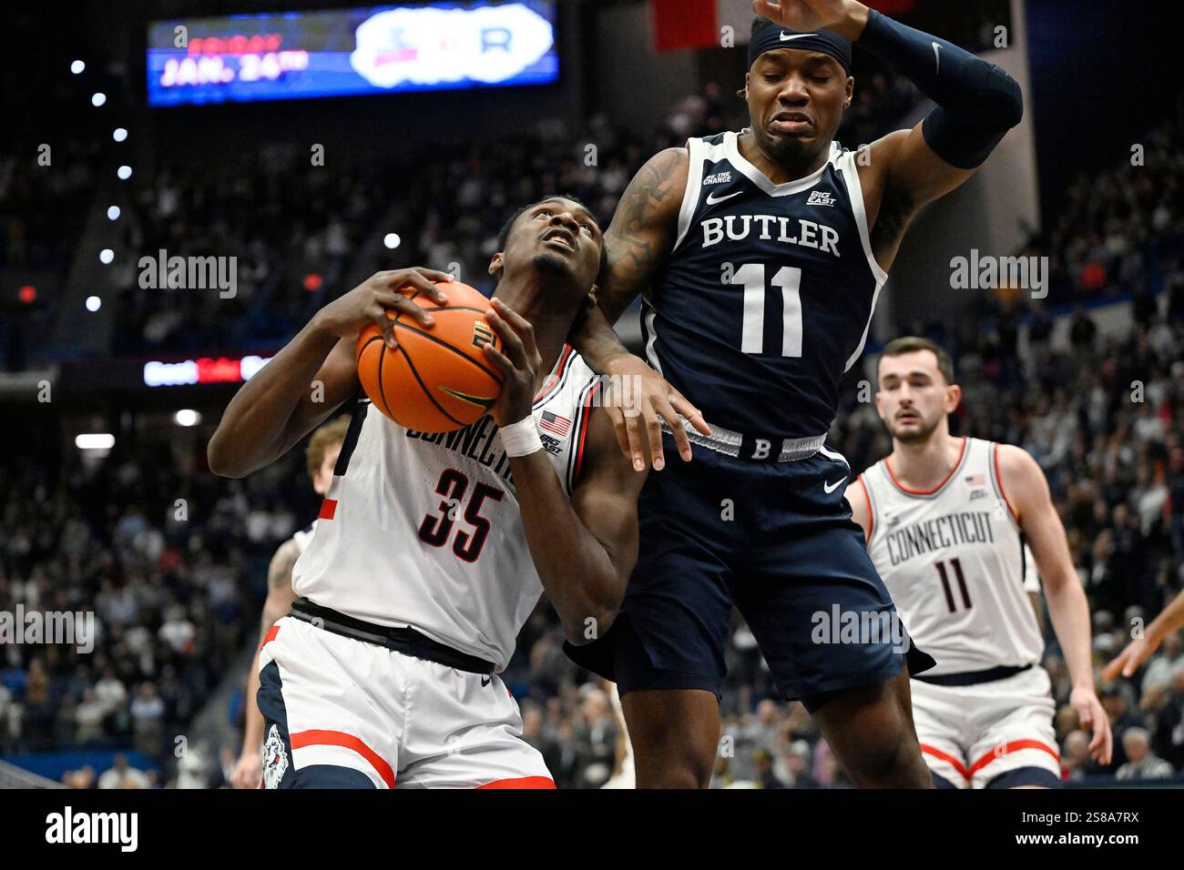 UConn center Samson Johnson (35) is fouled by Butler forward Jahmyl ...