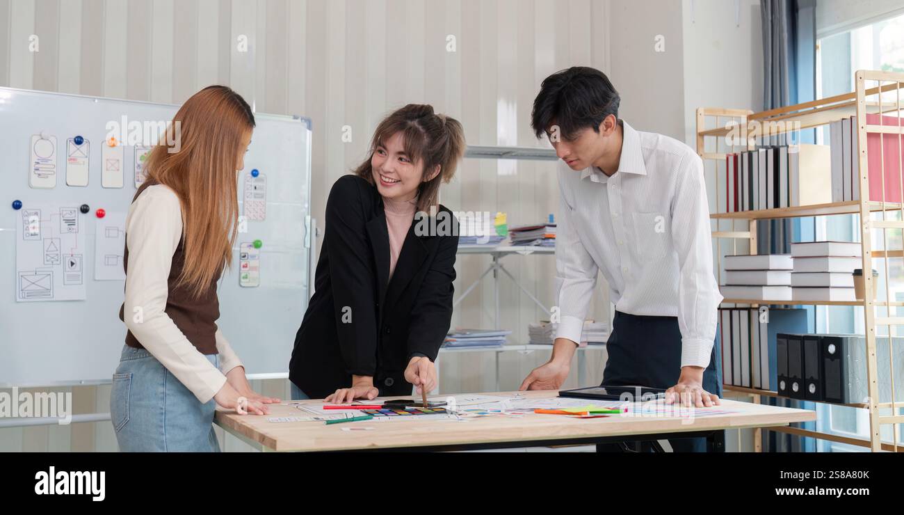 Collaborative Ux Ui Team Discussing Design Sketches And Strategies In A Bright Modern Office