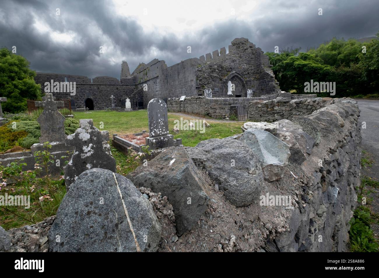 Stone wall surrounds the graveyard at ancient Murrisk Abbey Stock Photo ...