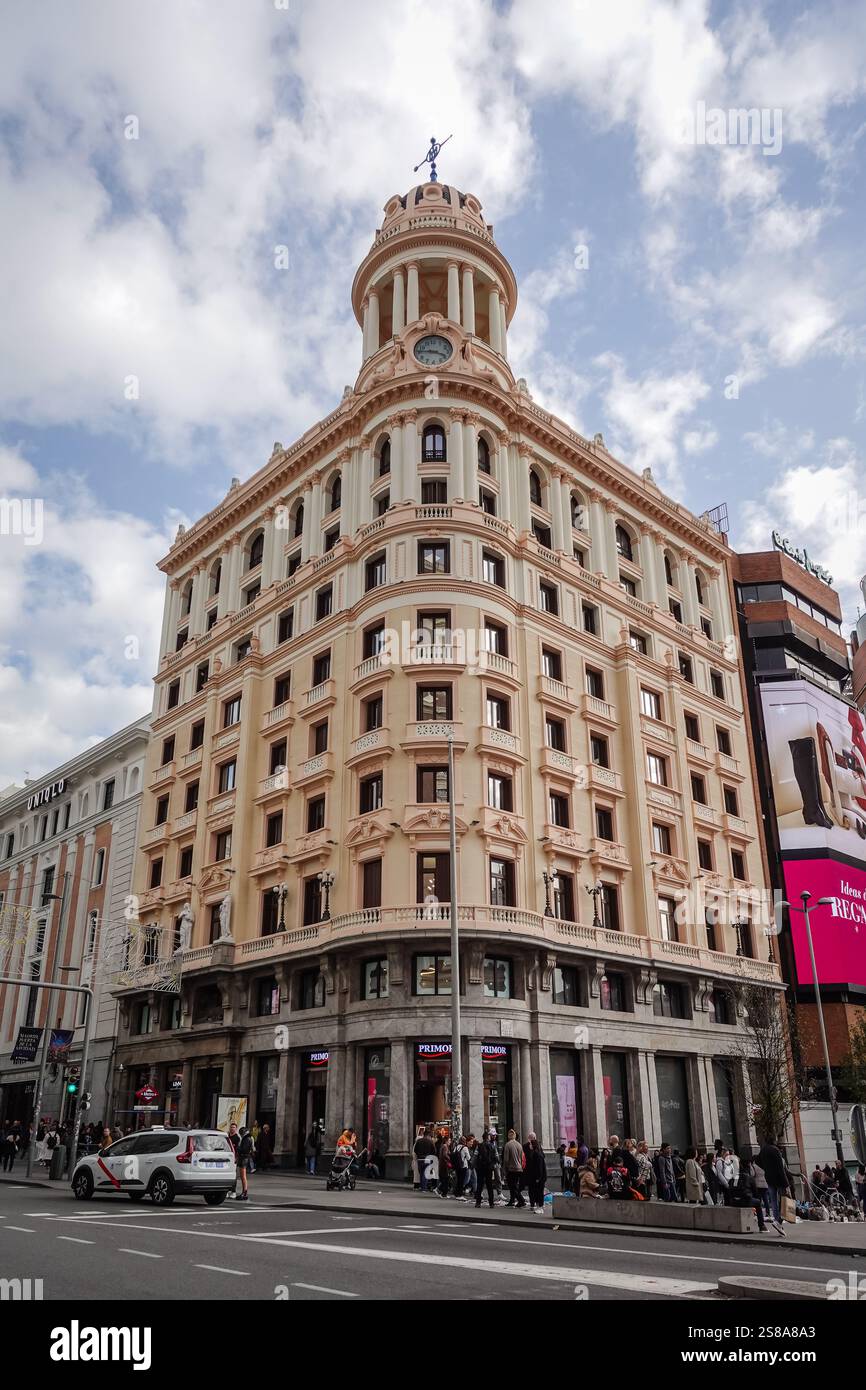 white historic architecture building on Gran Via in Madrid during the ...