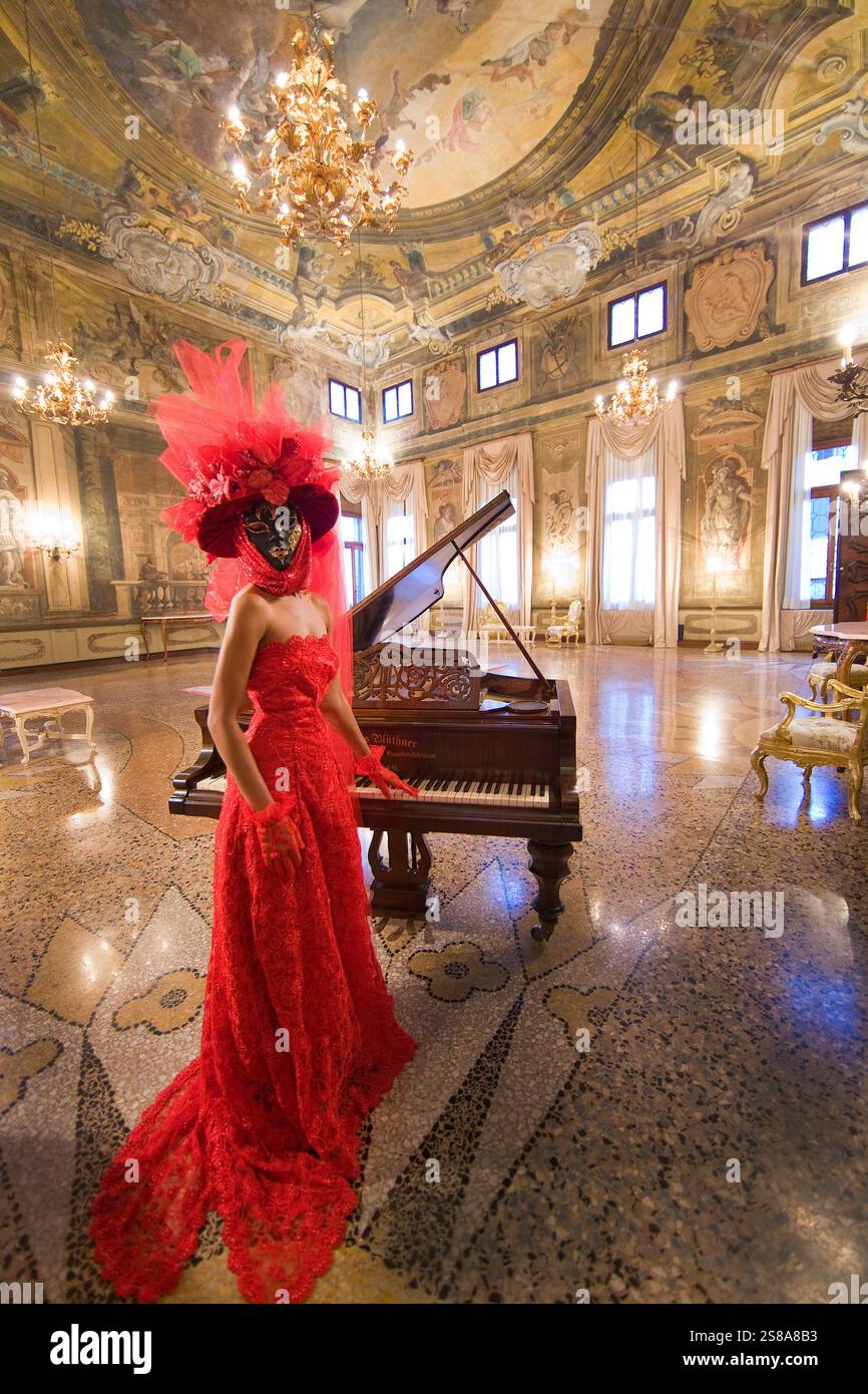 Italy, Venice. Model in Carnival costume poses in 5-star hotel. (MR ...