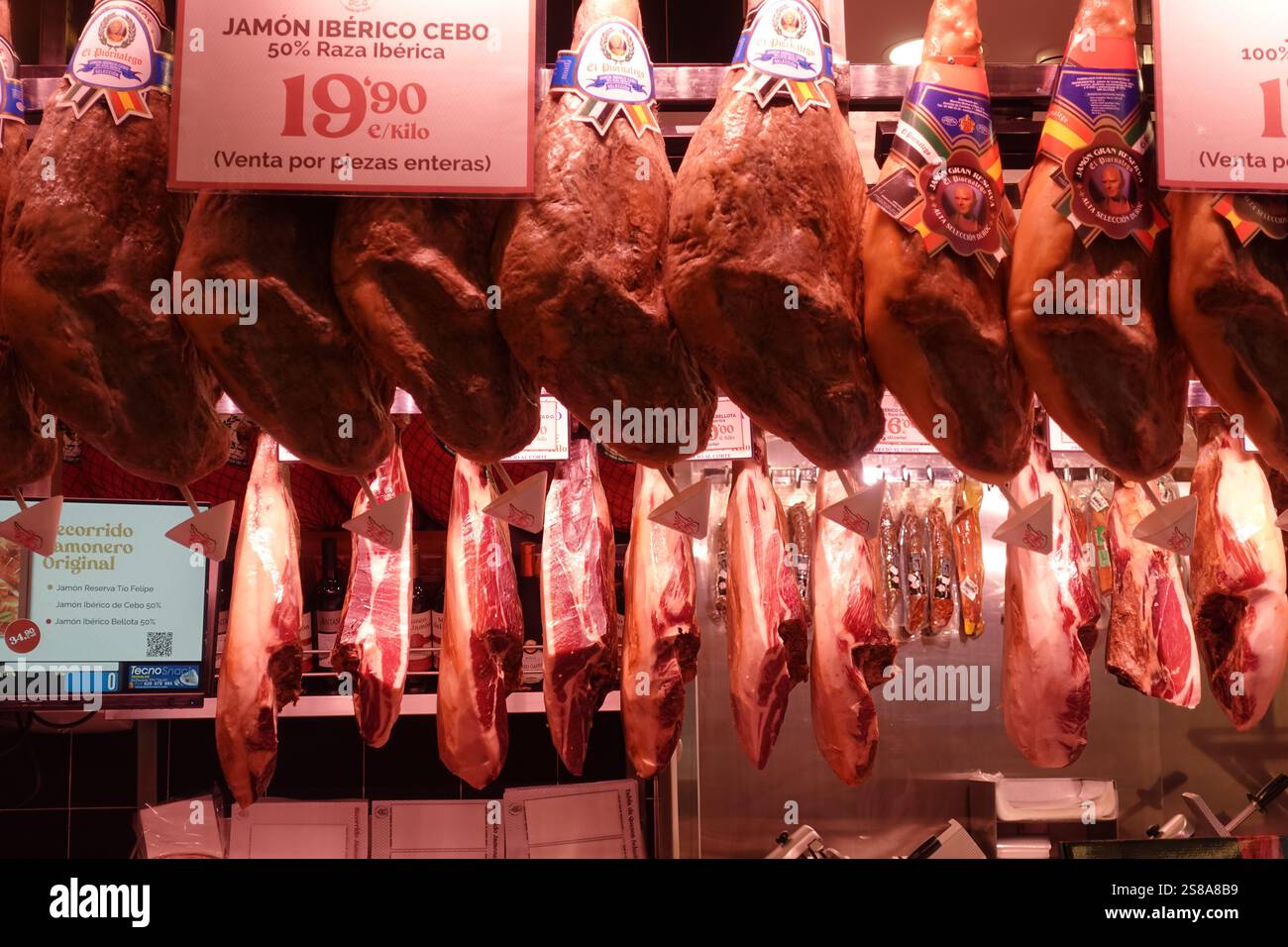 Jamon (cured ham) hanging inside a shop that sells them in Madrid Stock ...