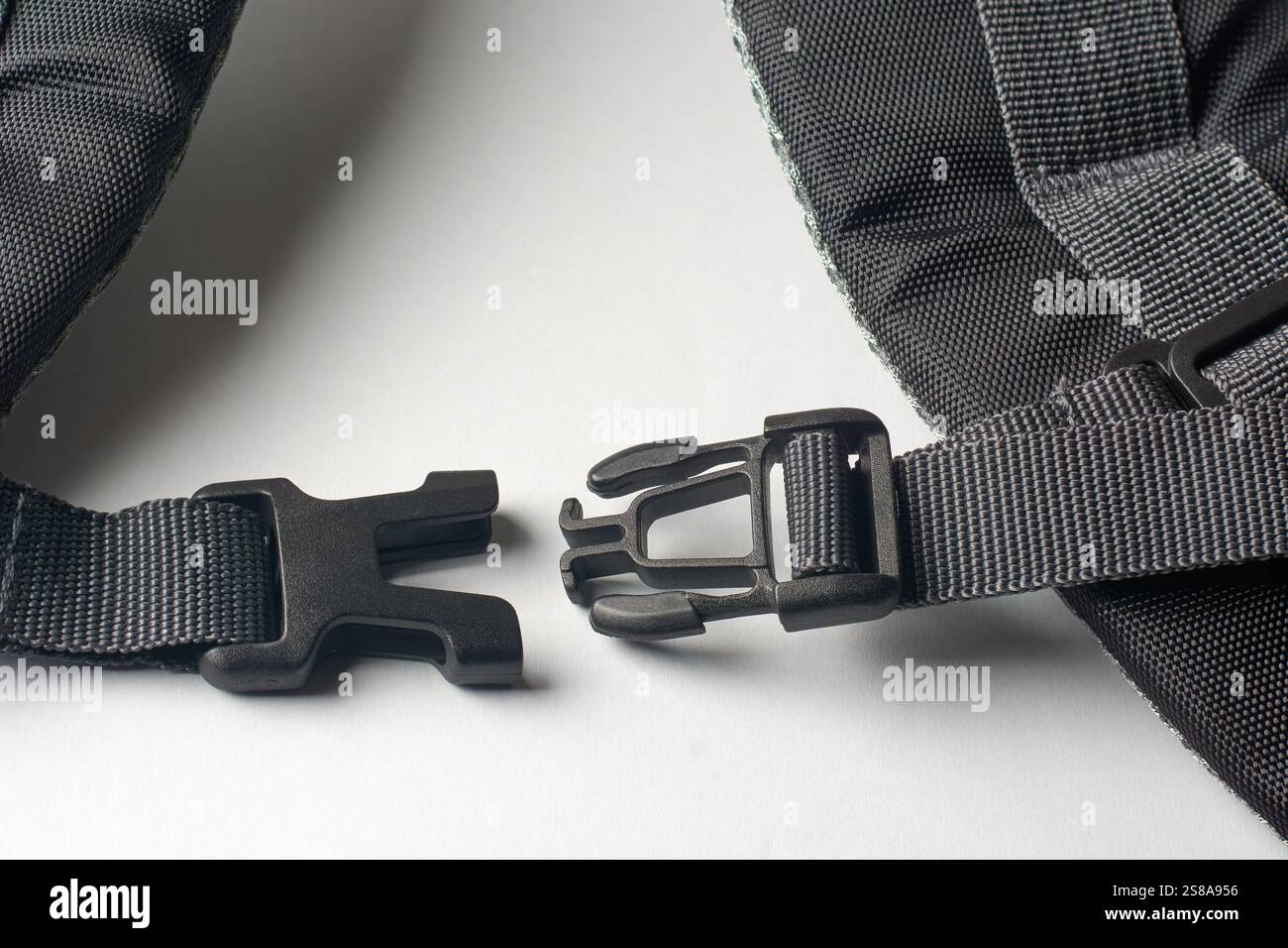 close-up of detached quick release black plastic buckle on shoulder ...