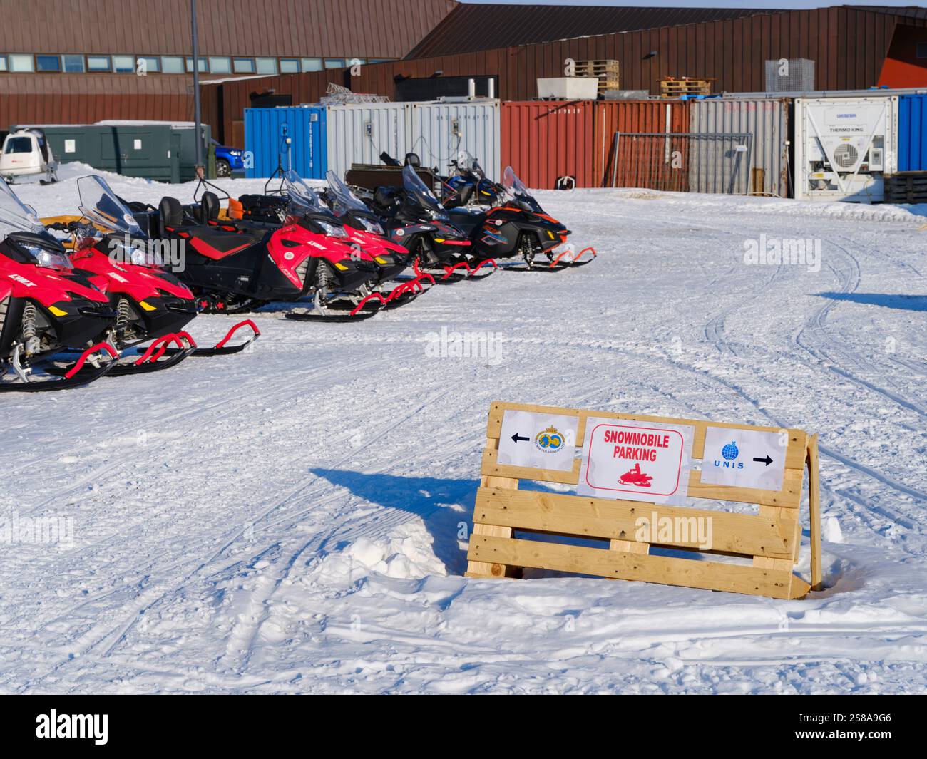 Parking of snowmobiles in front of the Svalbard Museum. Longyearbyen ...