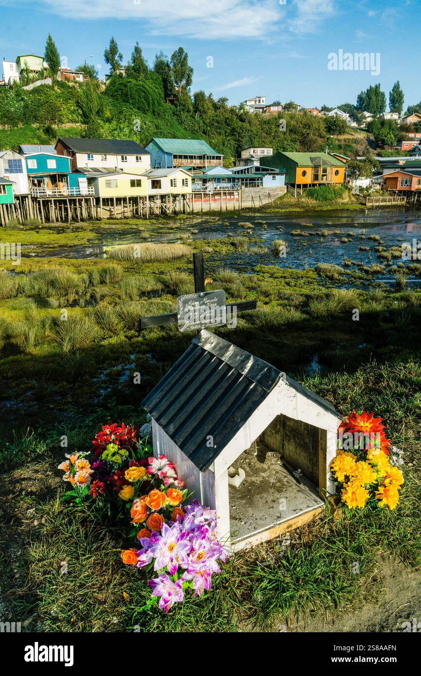 Chapel in memory of a deceased fisherman and traditional stilt houses ...