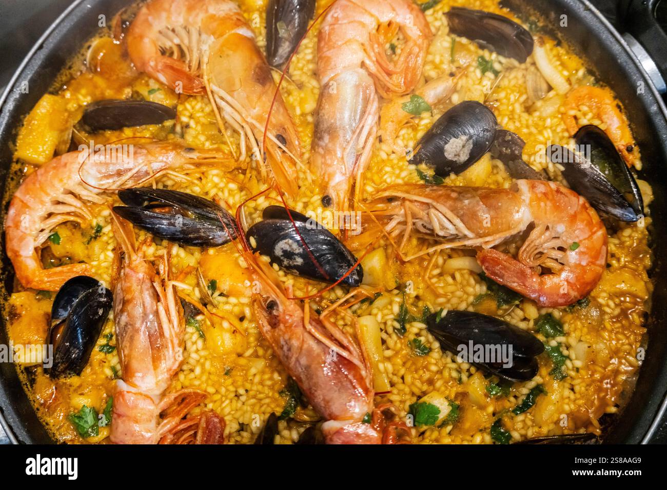 typical Spanish paella with fish and shrimp, Mallorca, Balearic Islands ...