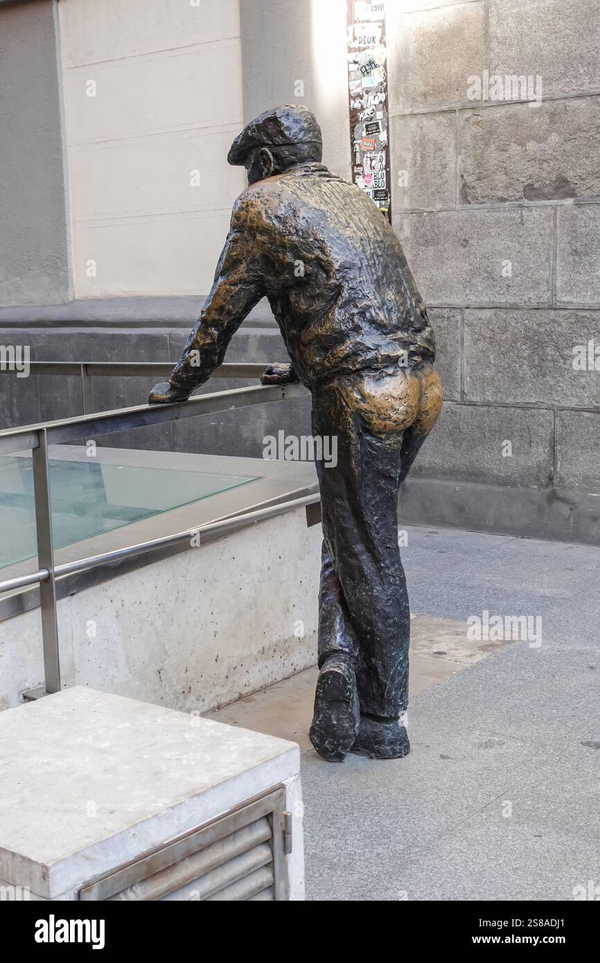 The 1999 bronze statue by Salvador Fernández Oliva portrays an elderly ...