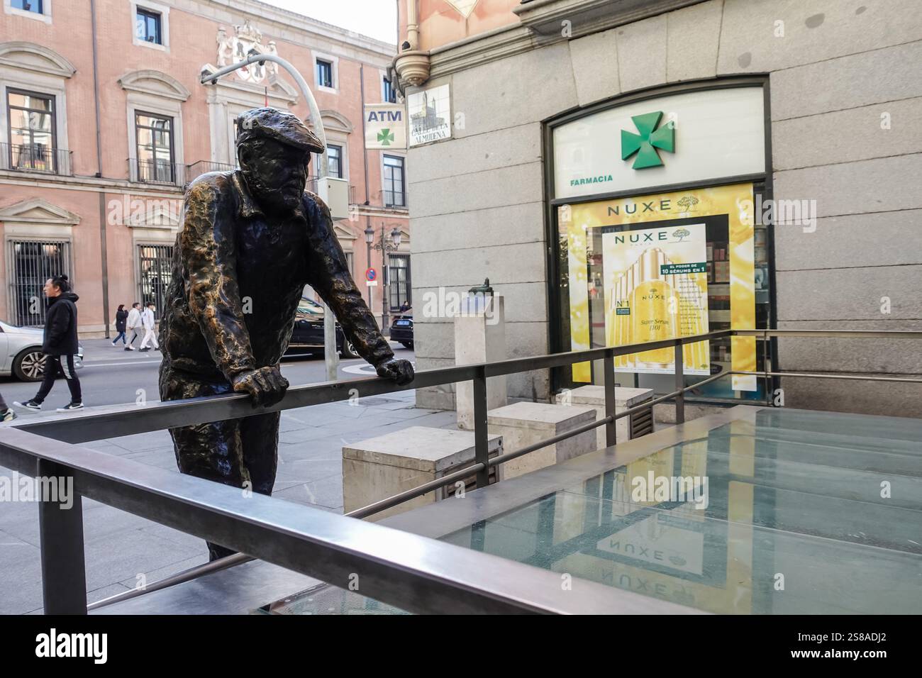The 1999 bronze statue by Salvador Fernández Oliva portrays an elderly ...