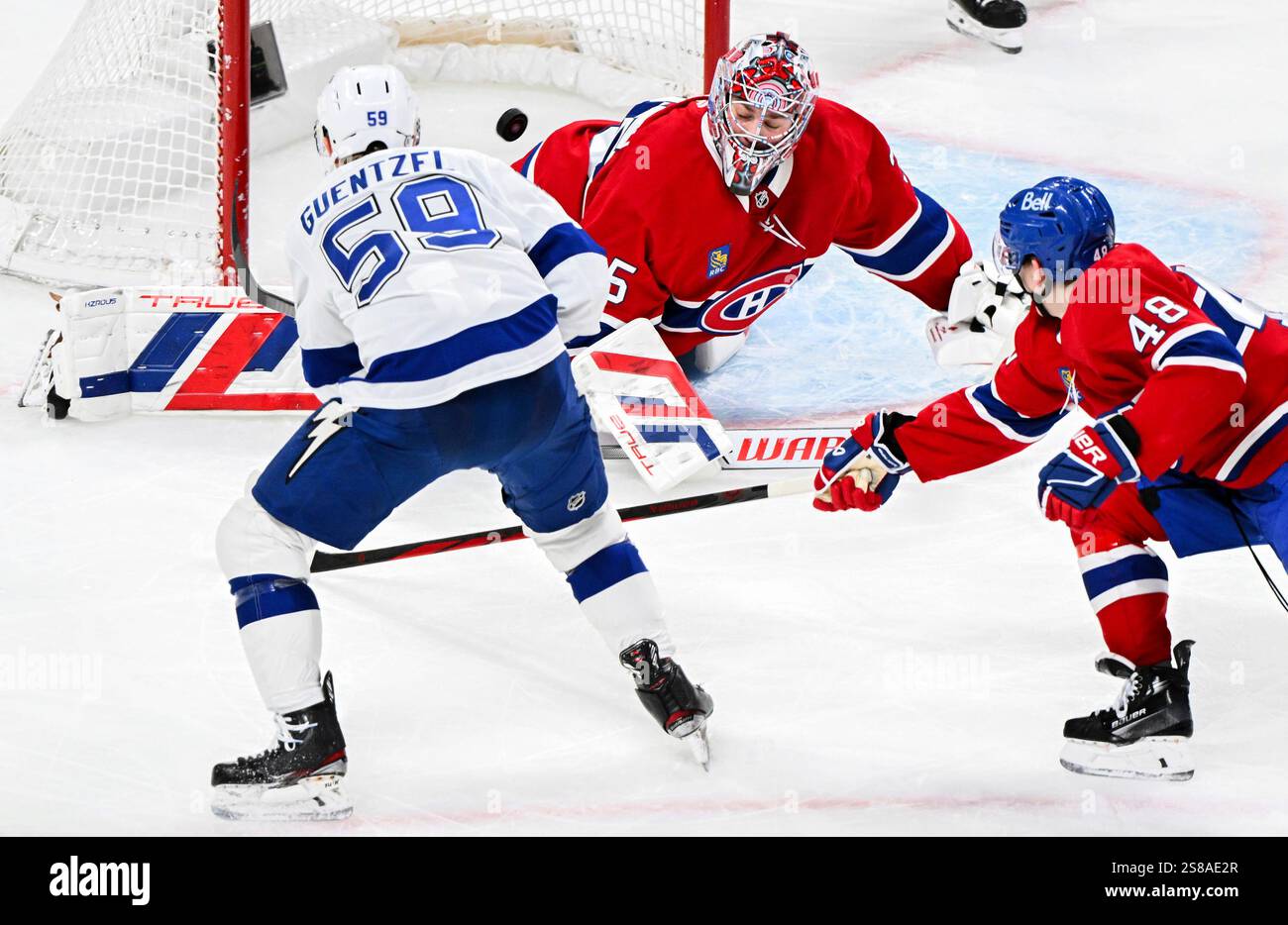 Tampa Bay Lightning's Jake Guentzel (59) shoots wide of Montreal ...