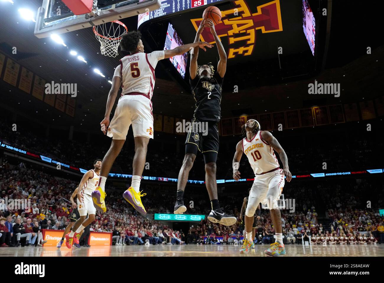 UCF forward JJ Taylor (2) fights for a rebound with Iowa State guard ...