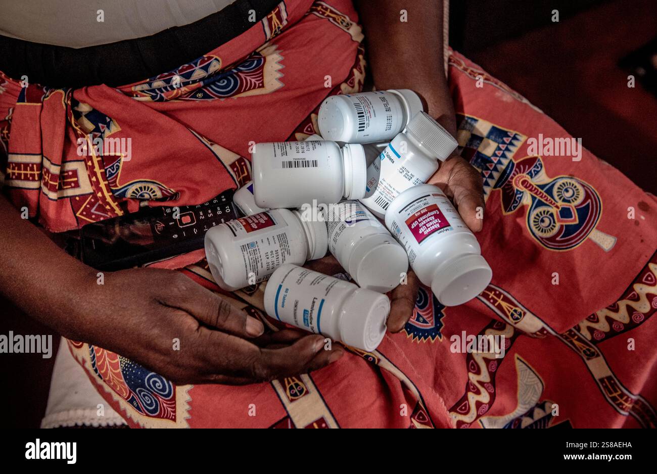 Editorial use only Patient with bottles of antiretroviral drugs for the ...