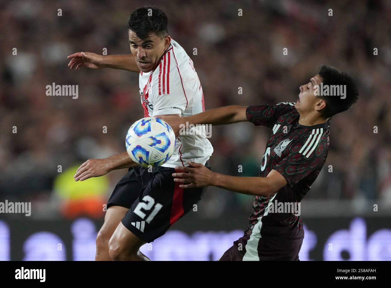 River Plate's Marcos Acuna, left, fight for the ball with Mexico's ...