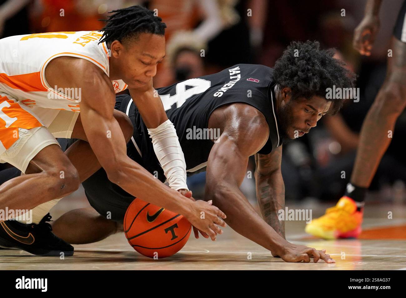 Tennessee guard Jordan Gainey, left, and Mississippi State forward ...
