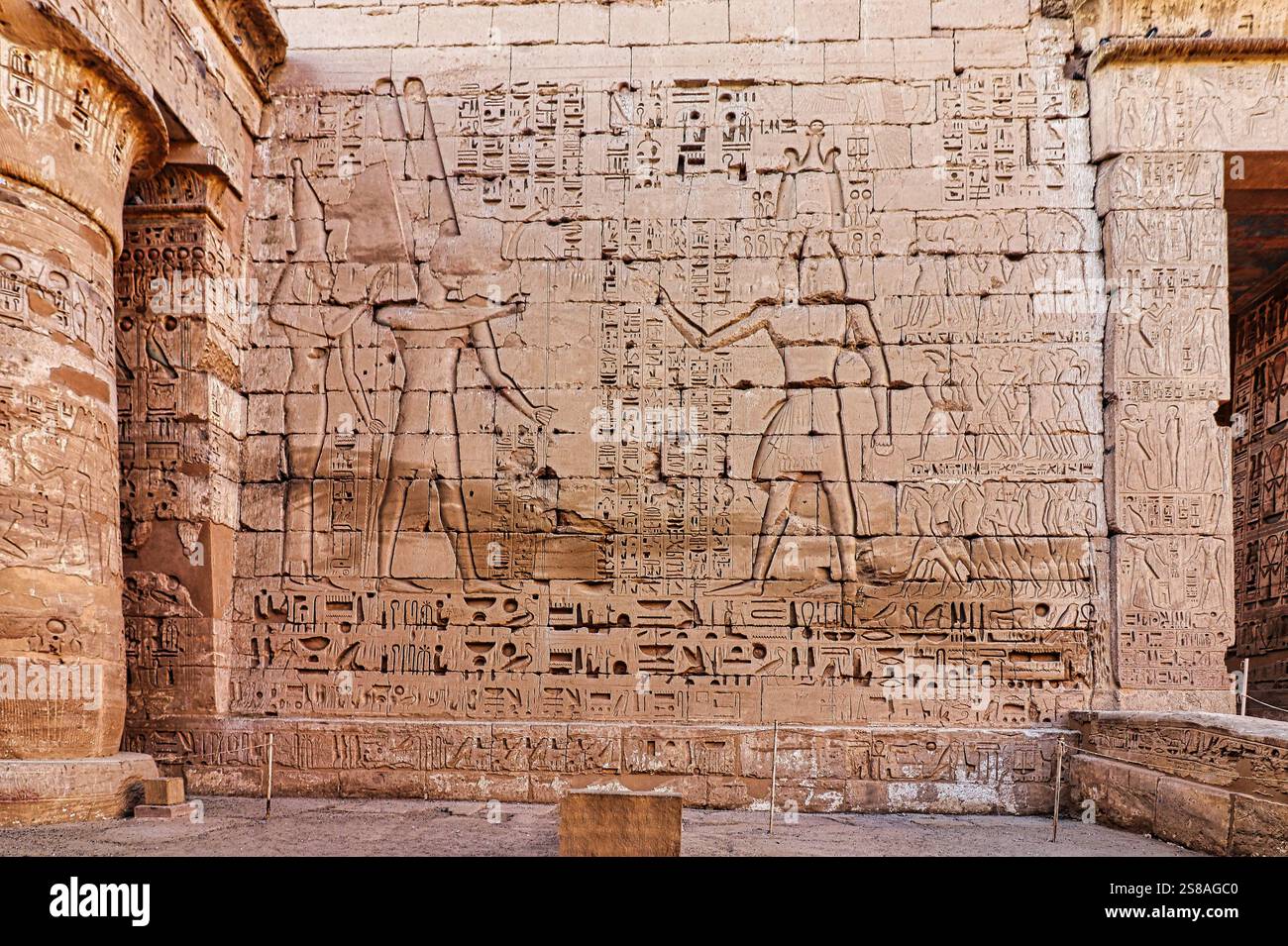 Famous wall relief of Ramesses III presenting captives of the Sea Peoples to Amun and Mut at ...