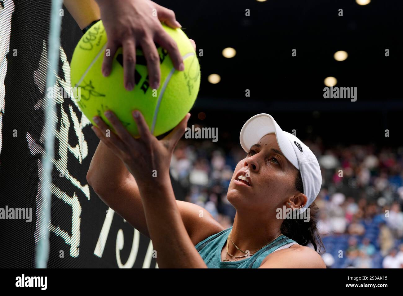 Madison Keys of the U.S. signs autographs after defeating Elina ...