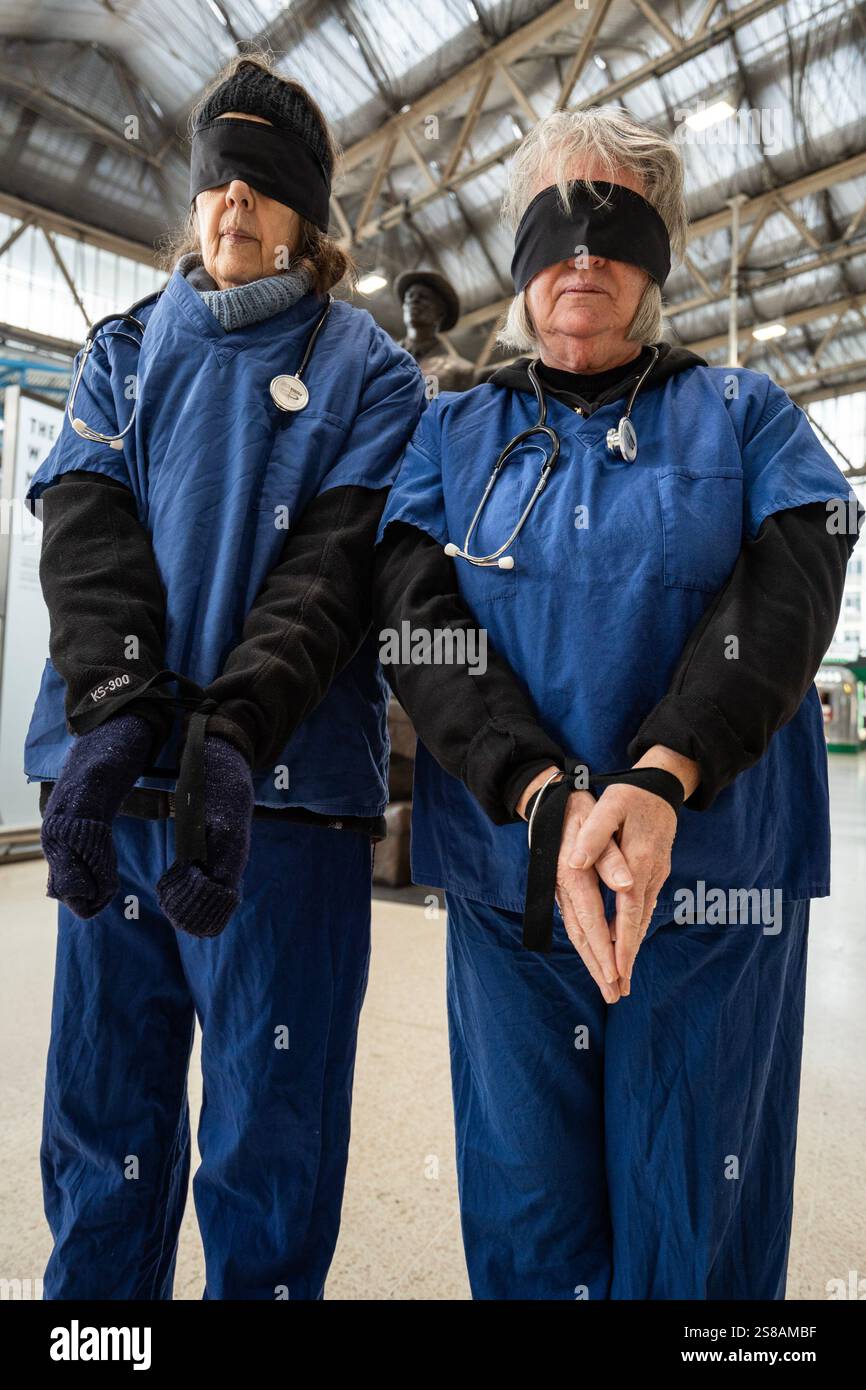 London, UK. 21st Jan, 2025. Campaigners wearing blindfolds and ...
