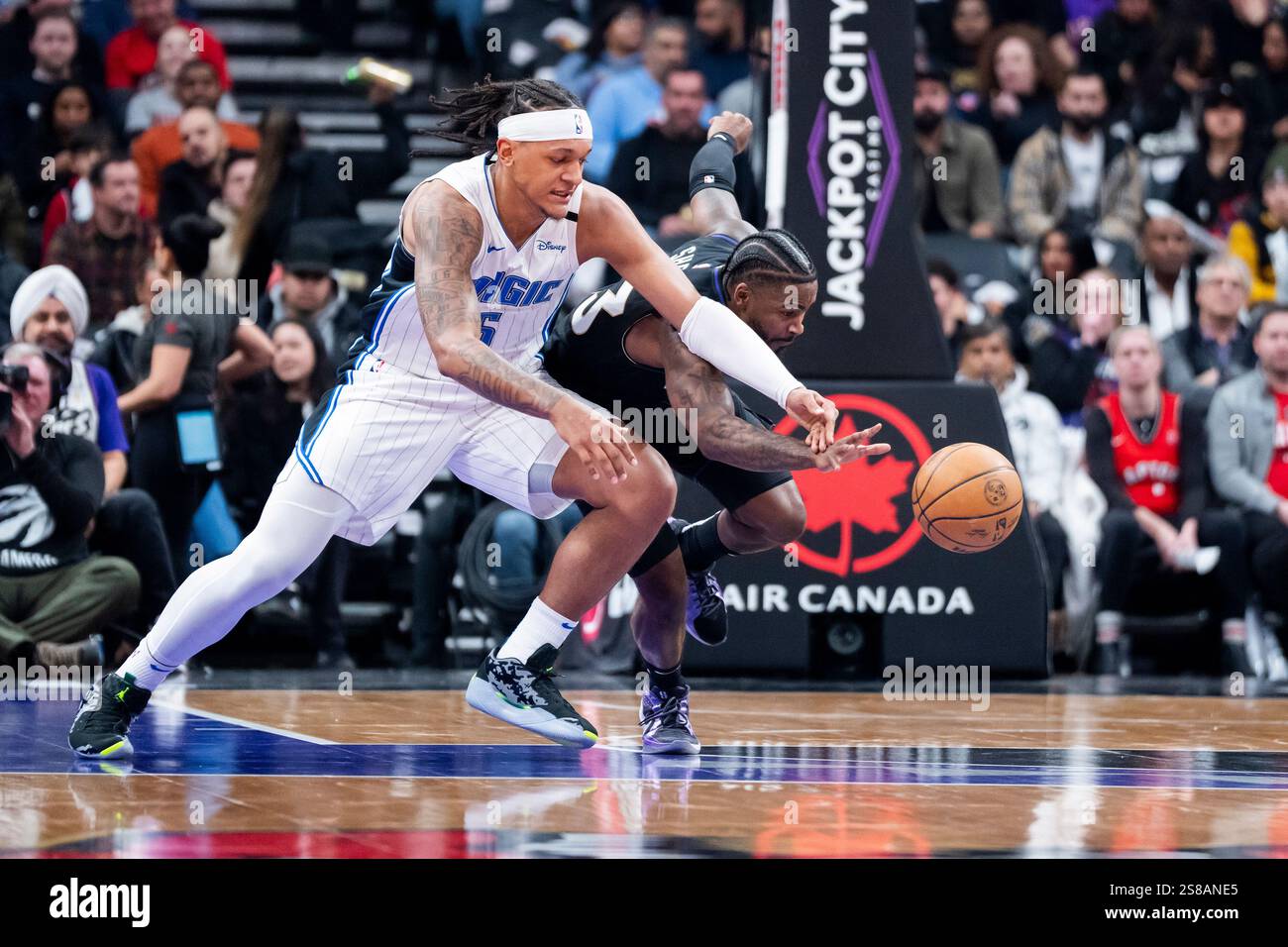 Toronto, Canada. 21st Jan, 2025. Orlando Magic forward Paolo Banchero (5) and Toronto Raptors ...