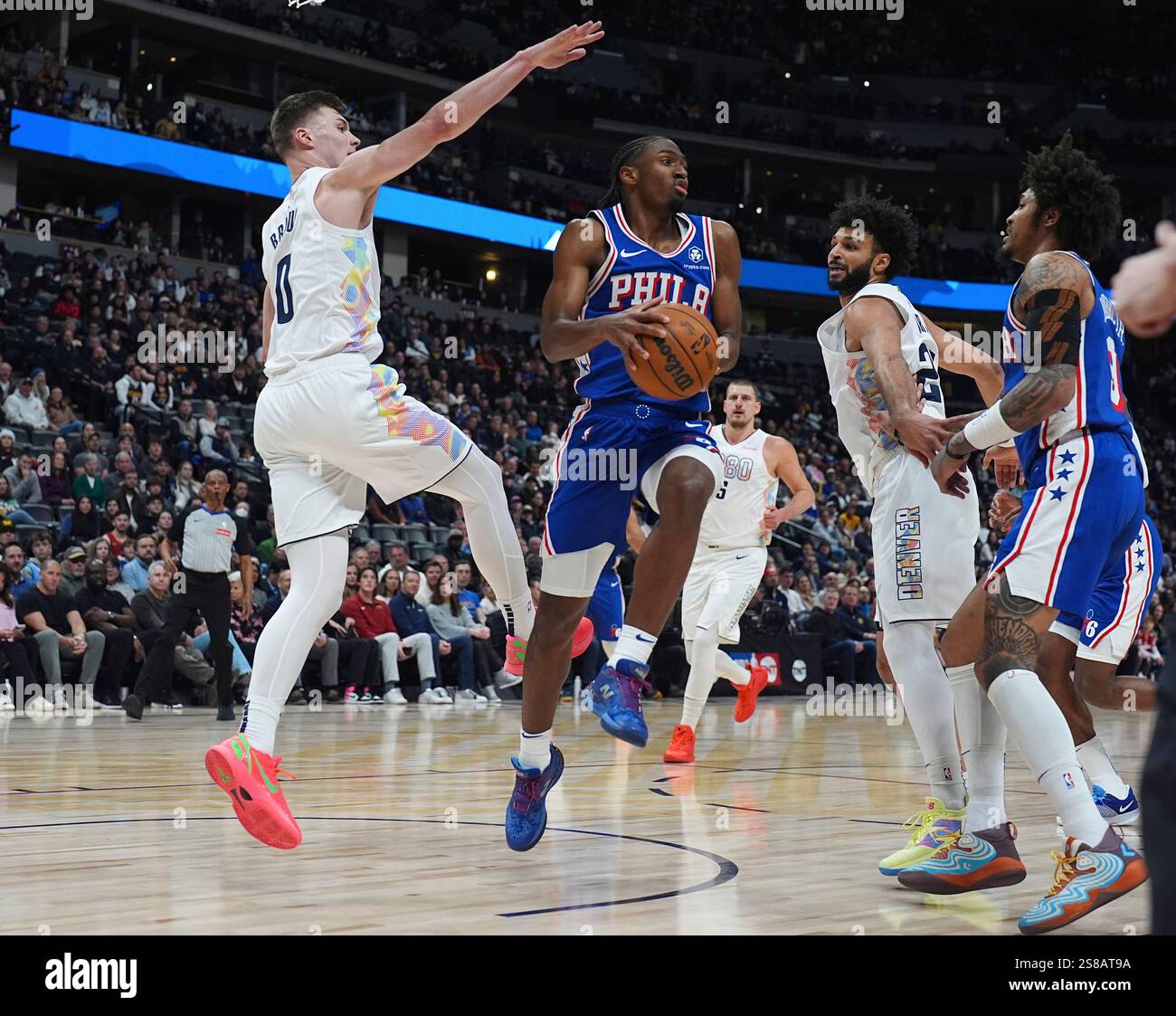 Philadelphia 76ers guard Tyrese Maxey, center, drives to the basket ...