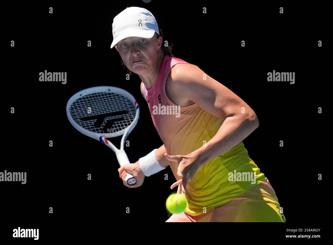 Iga Swiatek of Poland plays a forehand return to Emma Navarro of the U ...