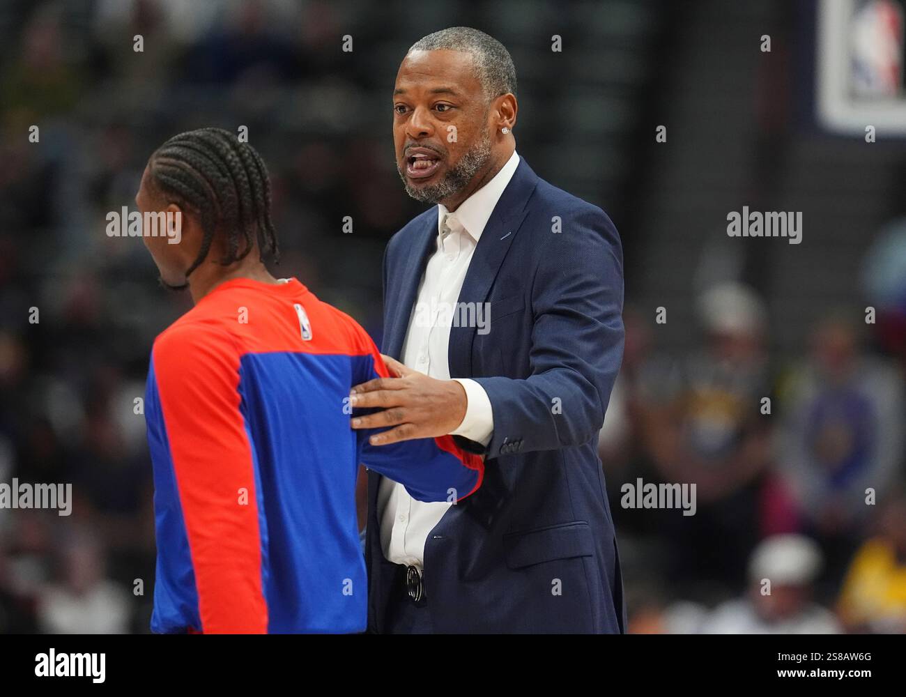 Retired Denver Nuggets forward Marcus Camby, right, greets Philadelphia ...