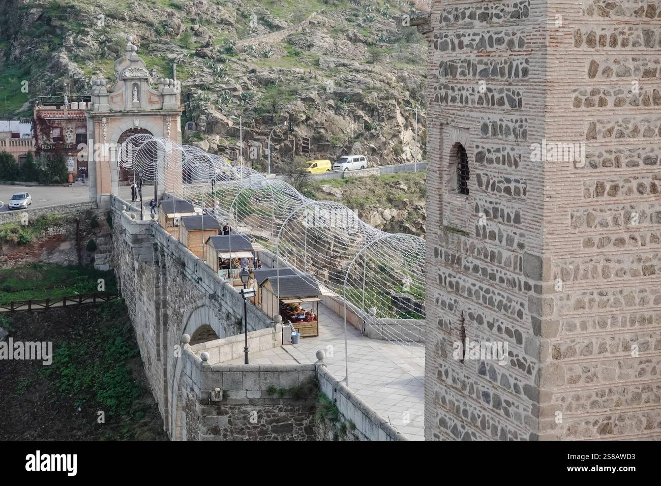 The historic Alcántara Bridge in Toledo, Spain, renowned for its ...