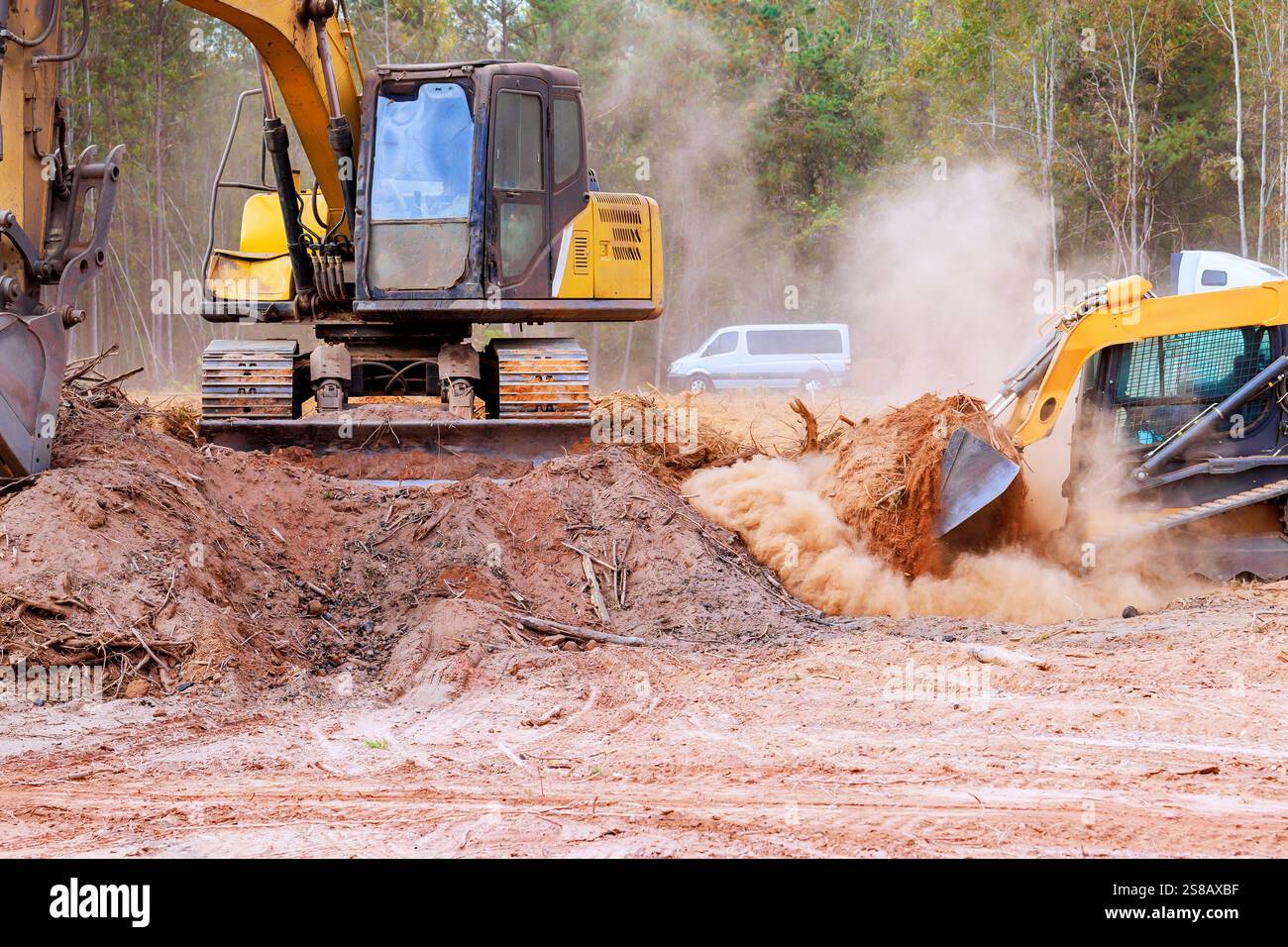 Tractor bulldozer is leveling ground earthmoving on construction site ...