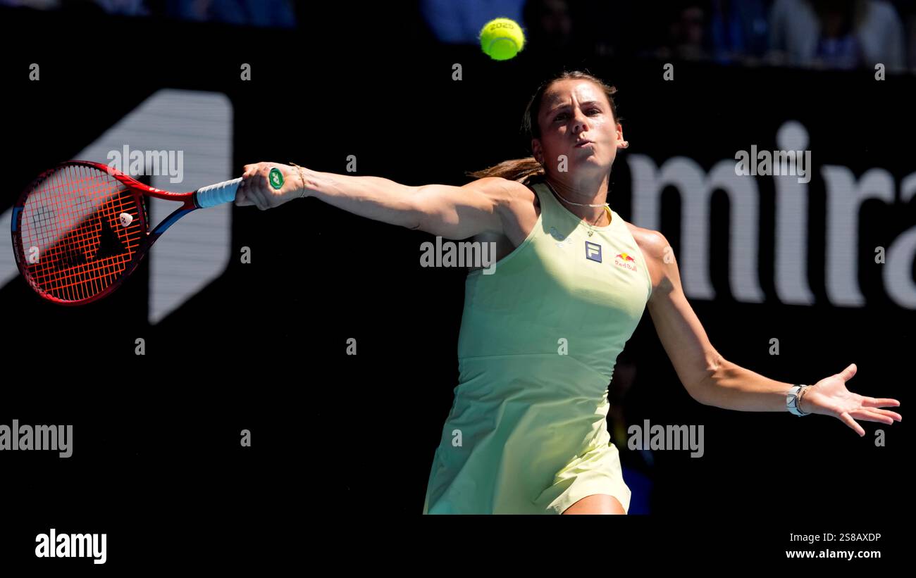 Emma Navarro of the U.S. makes a forehand return to Iga Swiatek of ...