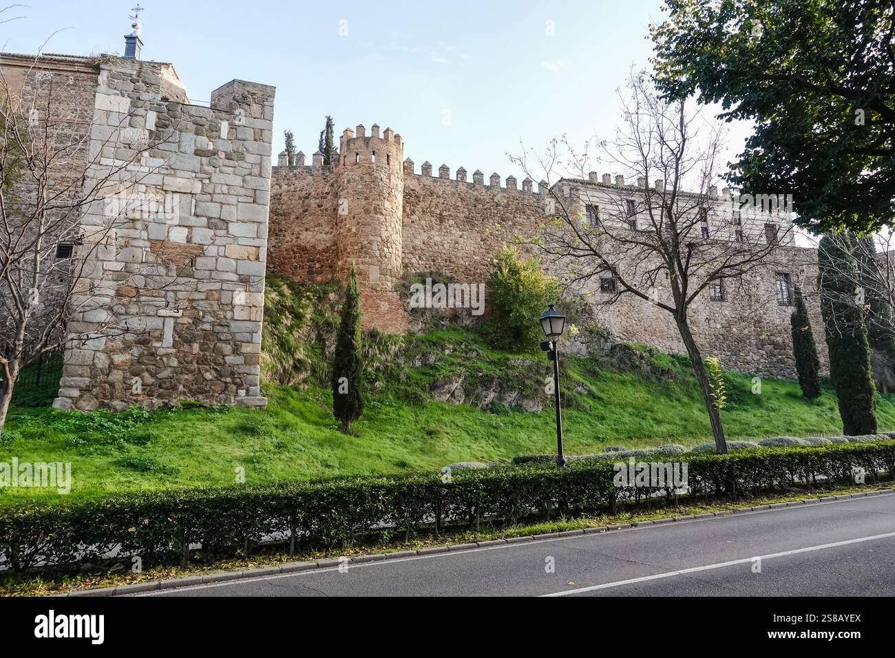 Description: Stone fortification with crenellations and towers, part of ...