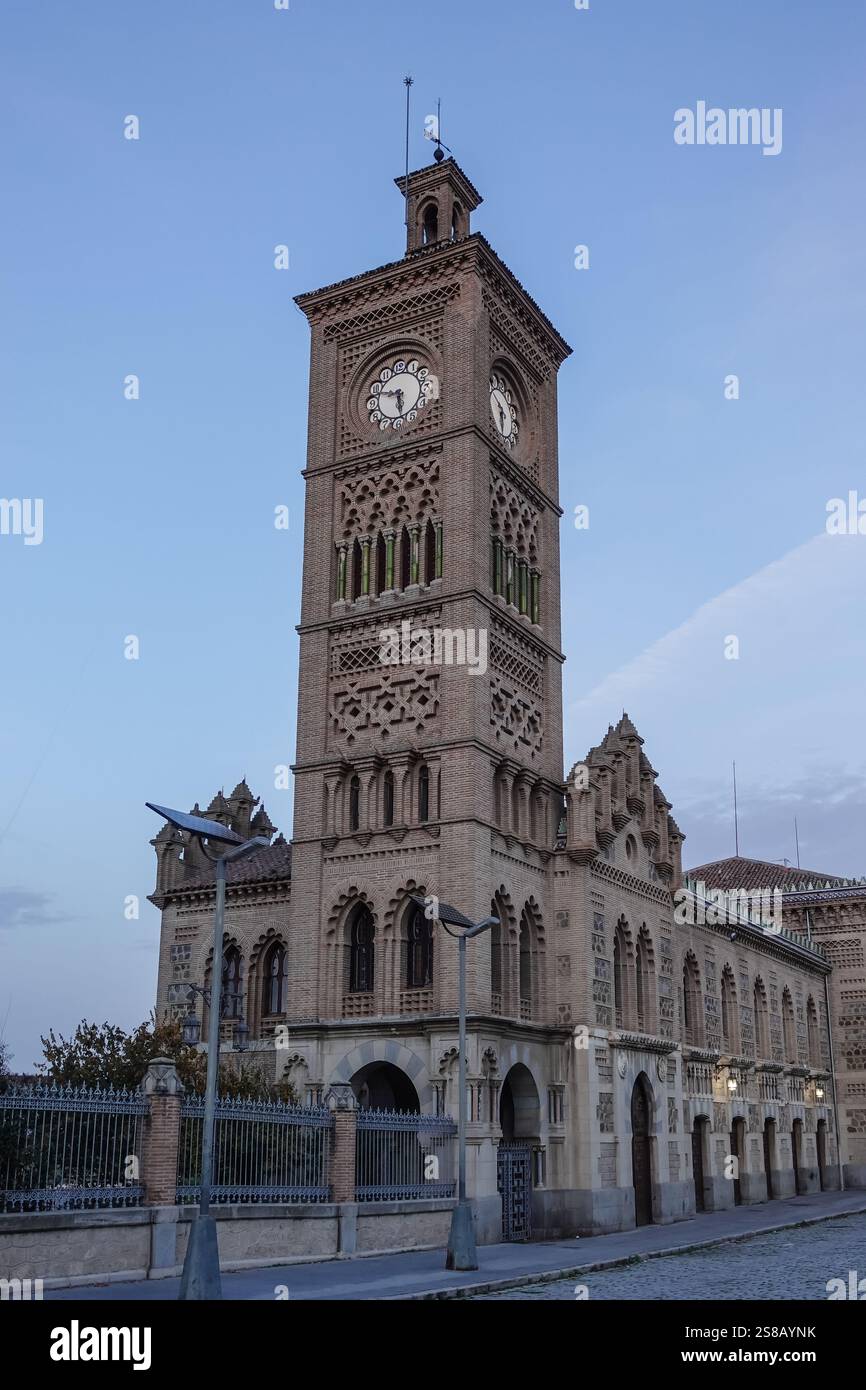 The exterior of Toledo's train station at night, featuring a prominent ...